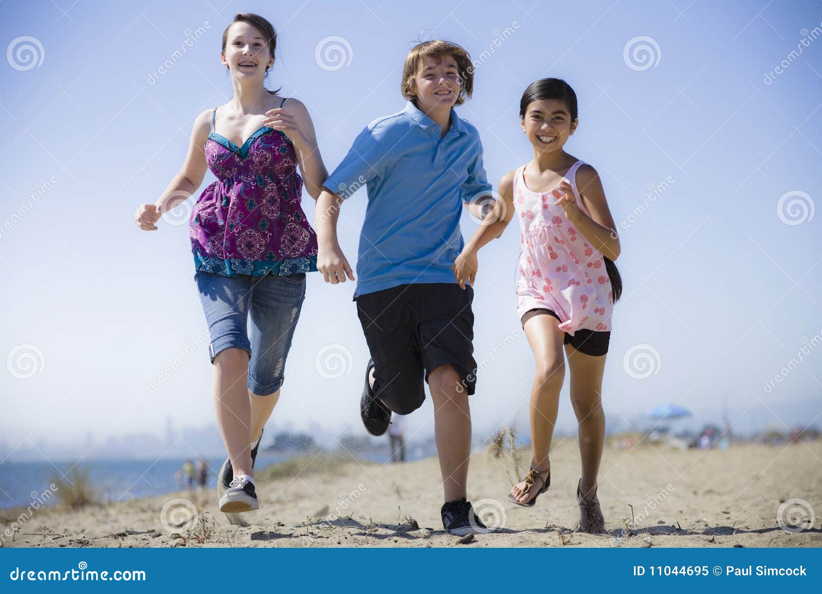Three Kids Running on Beach Stock Image - Image of happy, caucasian ...