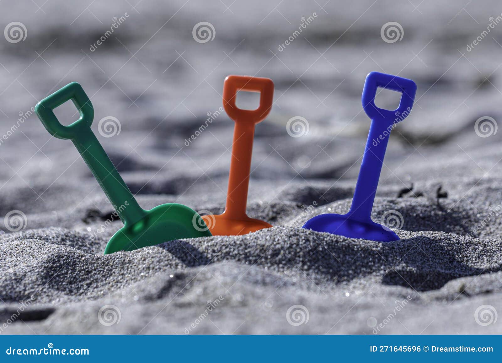 Three spades on the beach stock photo. Image of south - 271645696