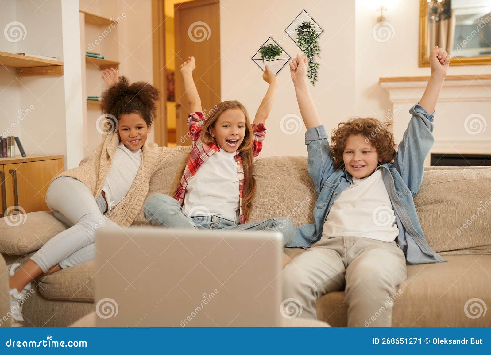 Three Kids Watching Something on a Laptop Stock Image - Image of teens ...