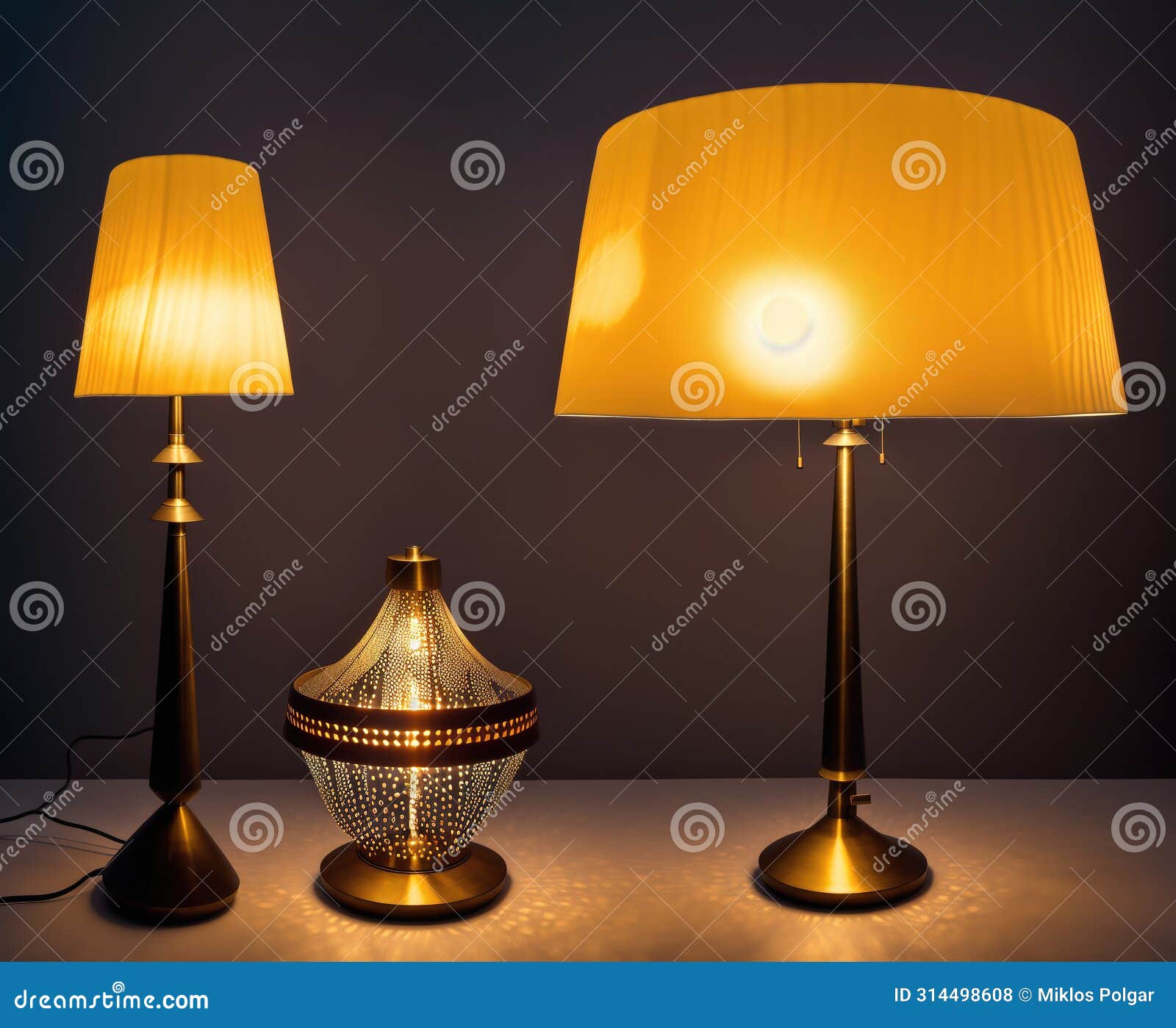Three Lamps on a Table with a White Shade and a Gold Base. Stock Photo ...