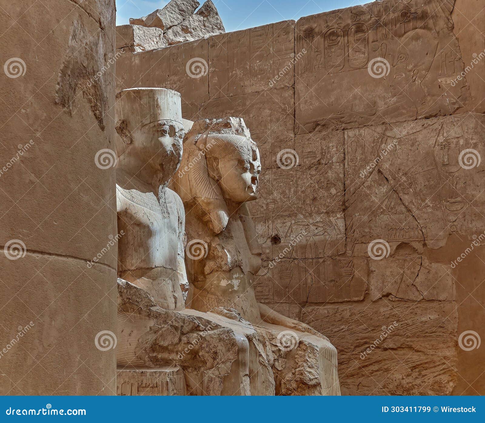 Some Large Statues Sitting in Front of a Building at the Temple ...