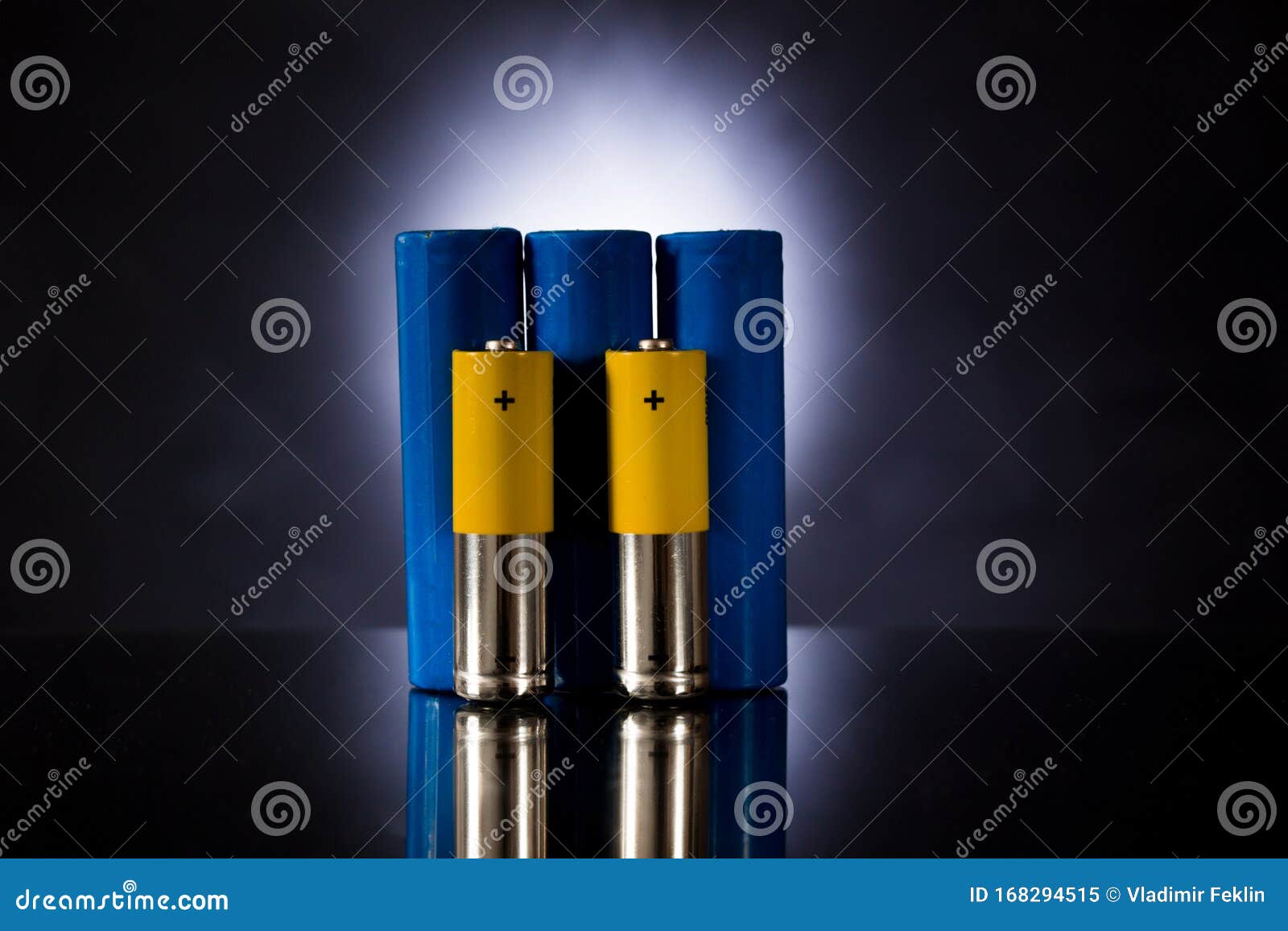 Three Large Blue Rechargeable Batteries and Two Yellow Small Ones Stock ...