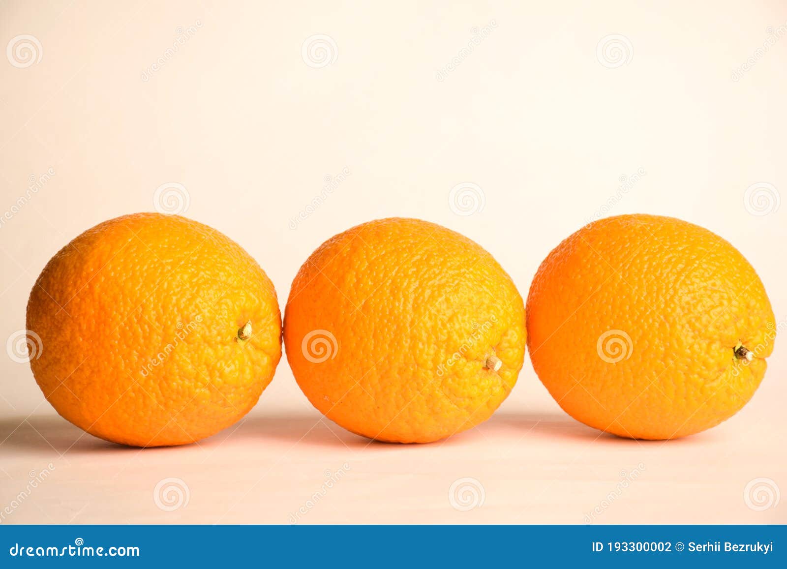 Three Large Oranges Lie in a Row on a White Background Stock Photo ...