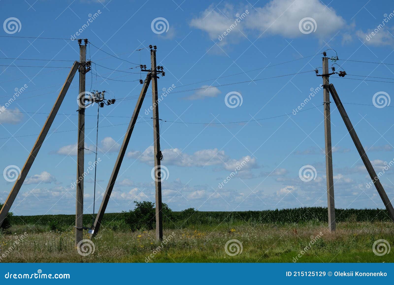 Three Large Poles of Power Lines in the Field Stock Image - Image of ...