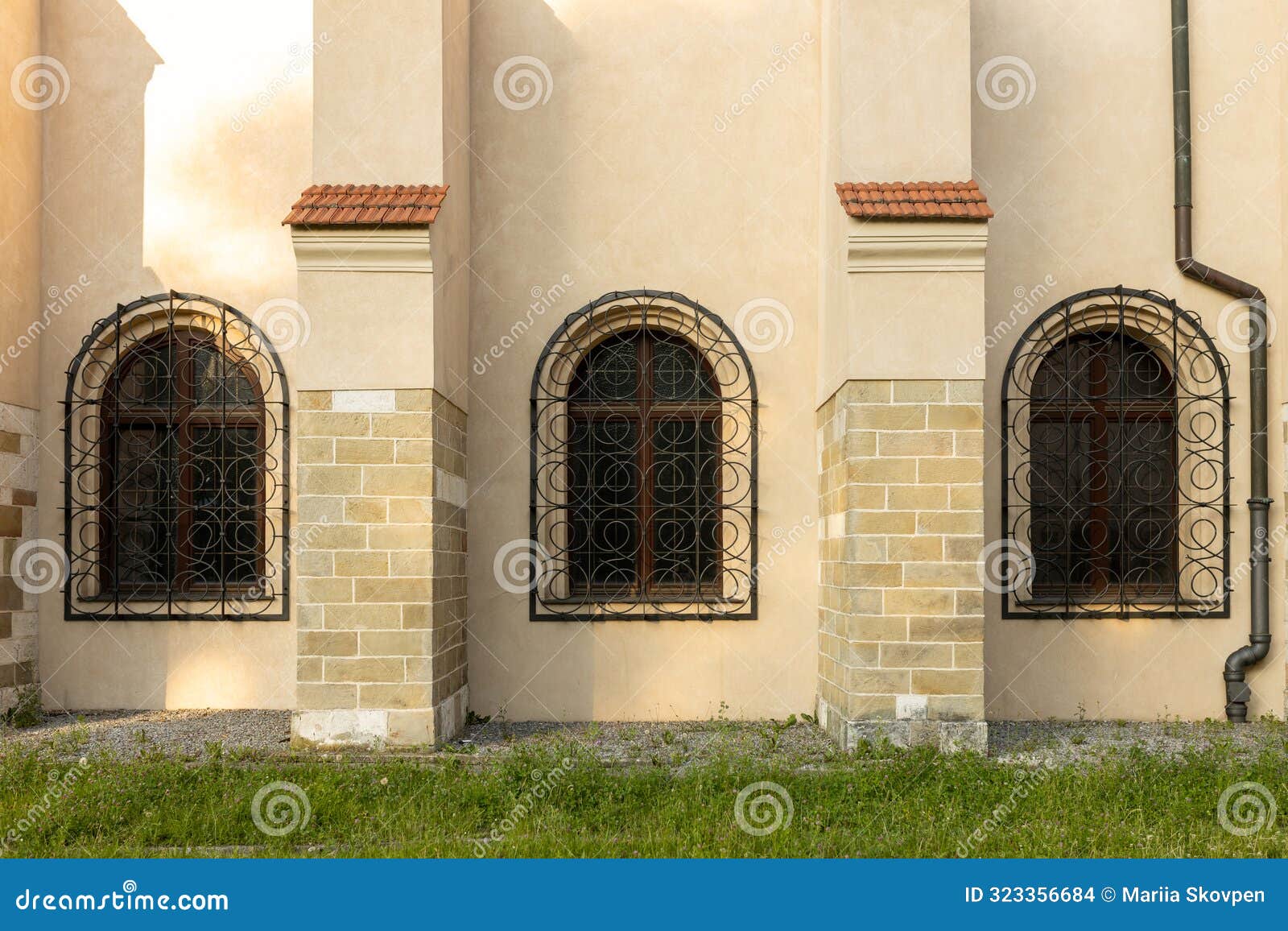 Three Large Windows with Traditional Iron Grille. Stock Photo - Image ...