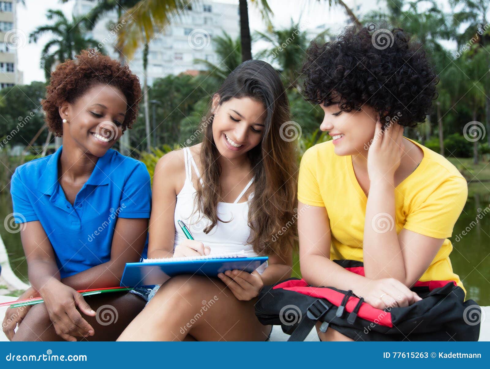 Three Laughing Female Students Learning Outdoor Stock Image - Image of ...