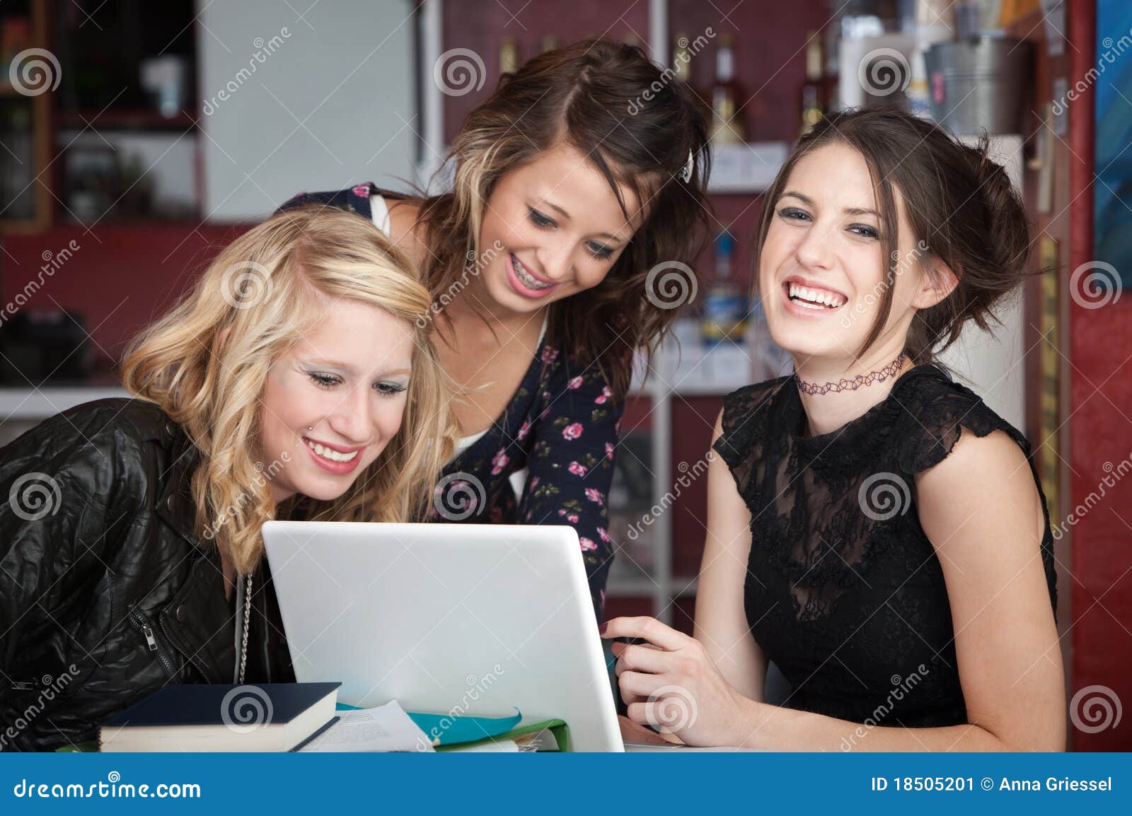 Three Laughing Girls stock image. Image of brunette, computer - 18505201
