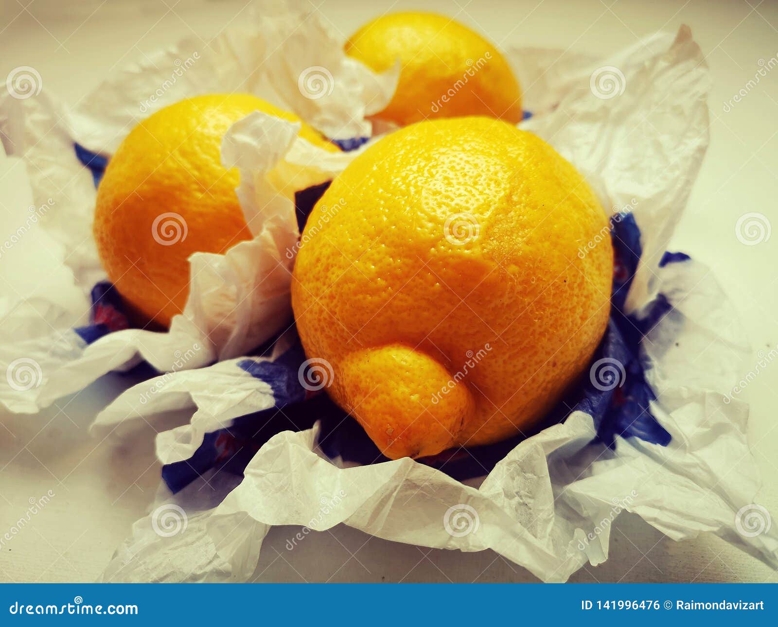 Three lemons on paper stock photo. Image of lemons, yellow - 141996476
