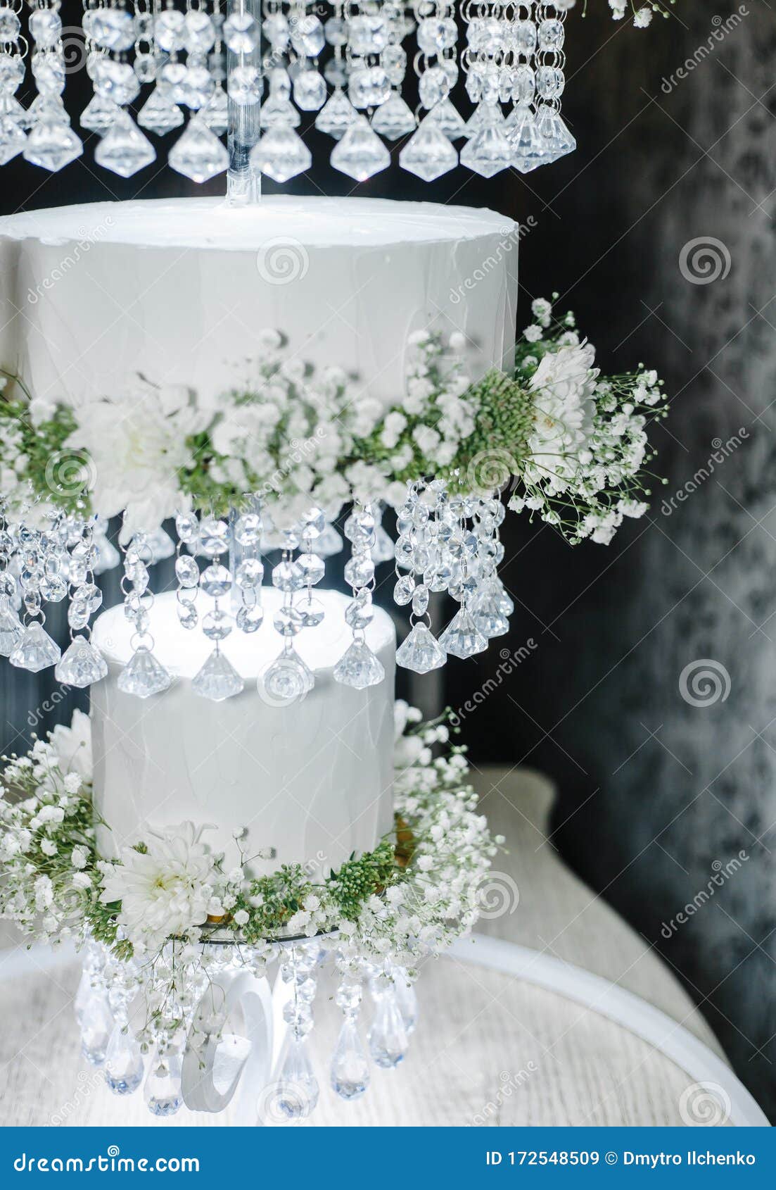 Three-level Wedding Cake on a Decorative Stand with Hanging Levels ...