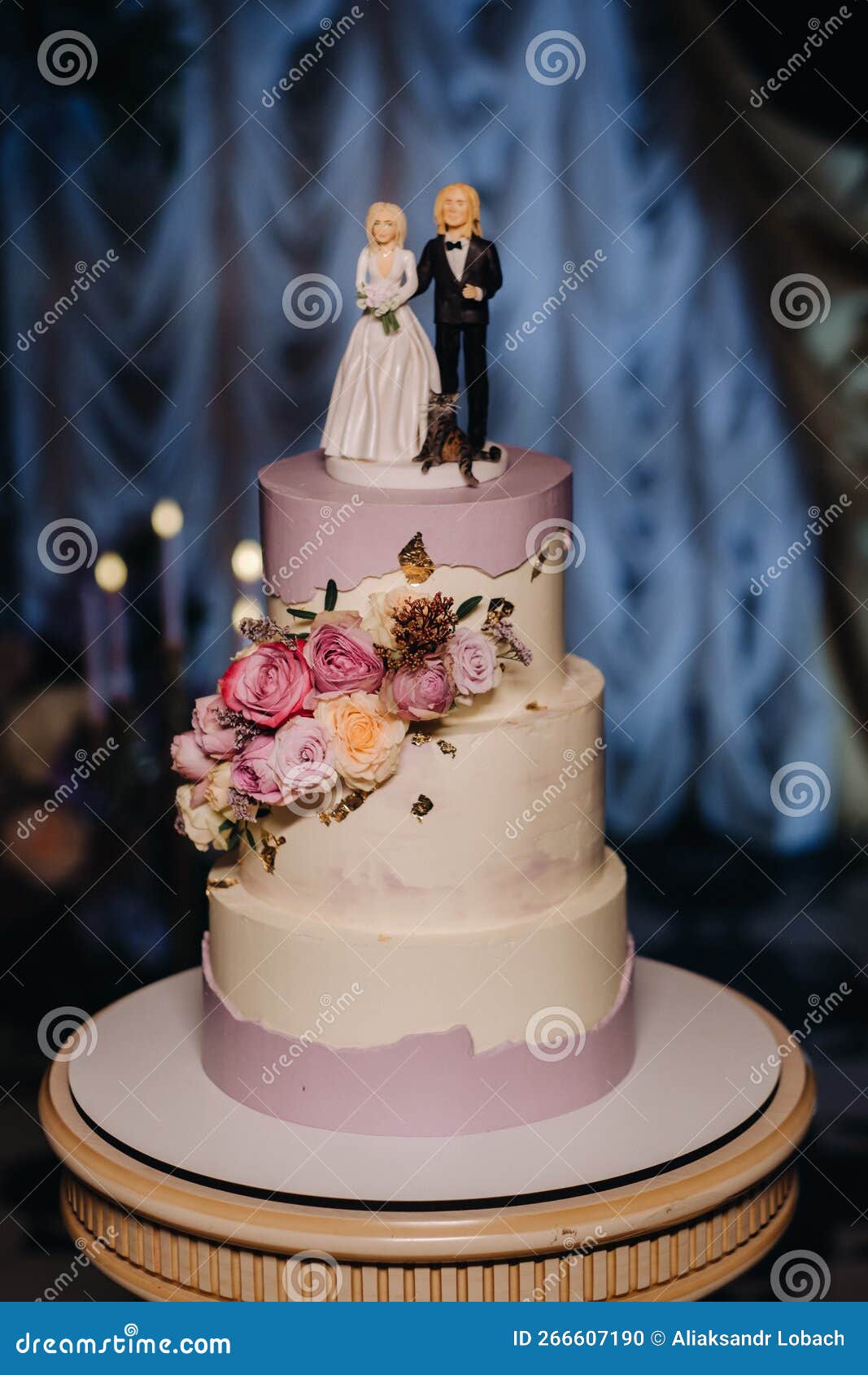 Three-level Wedding Cake with Figures of People on it Stock Photo ...