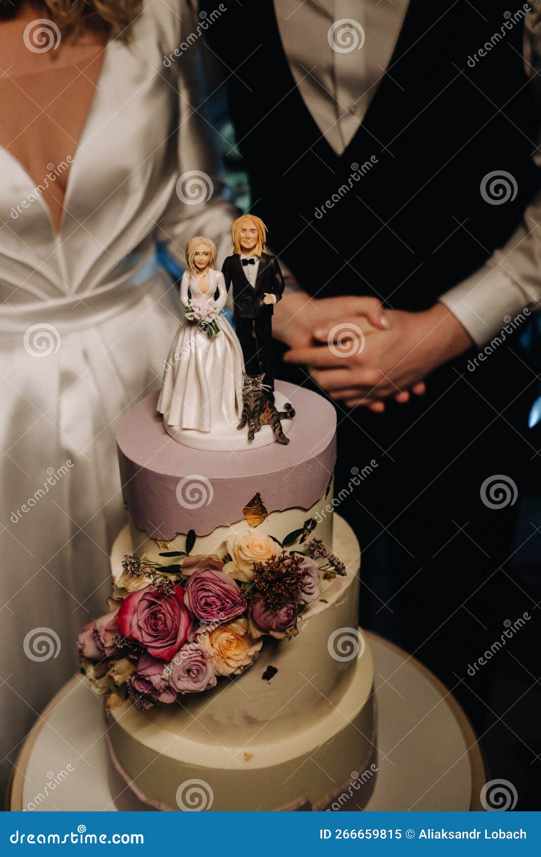 Three-level Wedding Cake with Figures of People on it Stock Image ...
