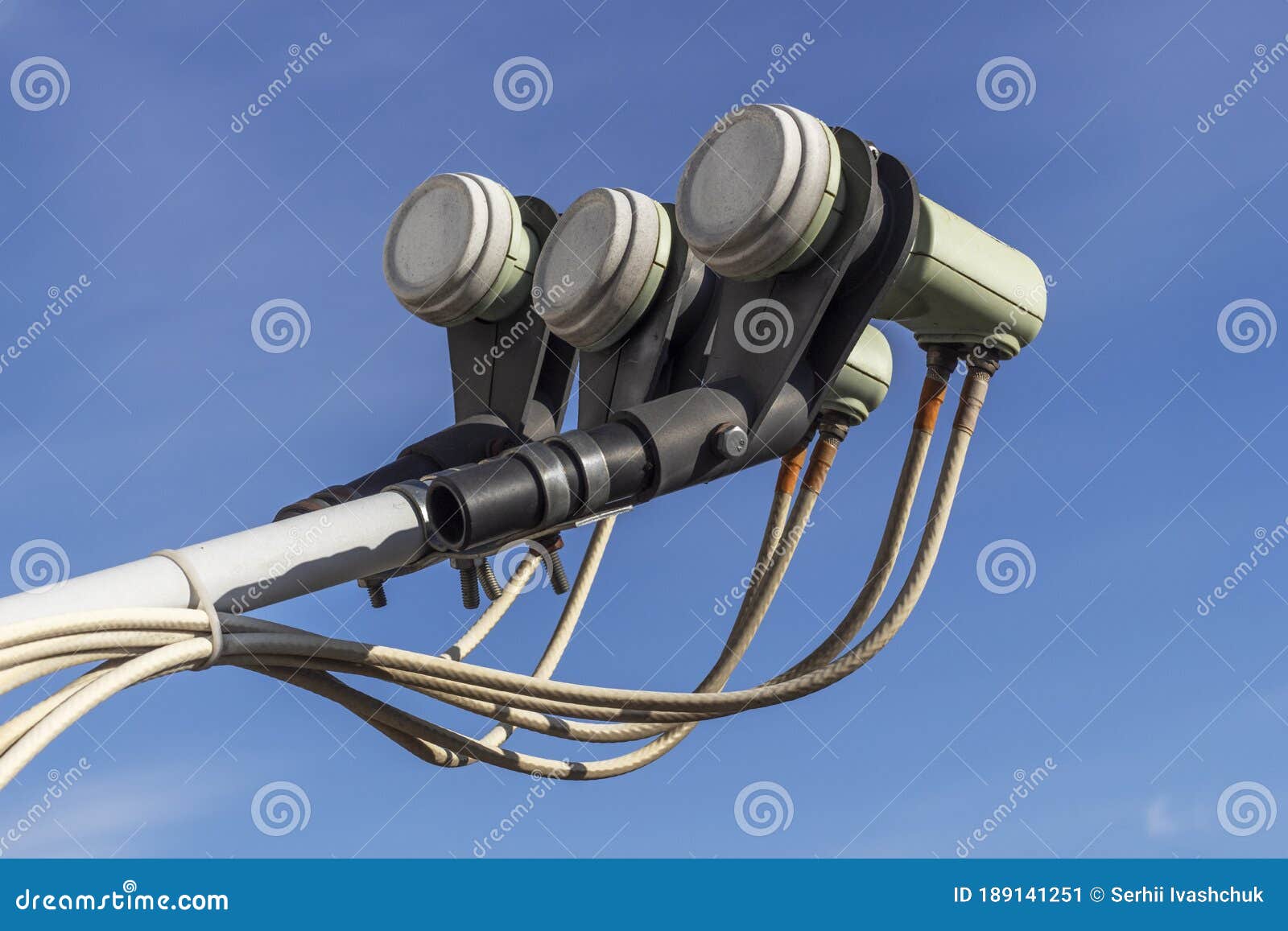 Three Linear Polarised LNB of a Satellite Dish Closeup on Blue Sky ...