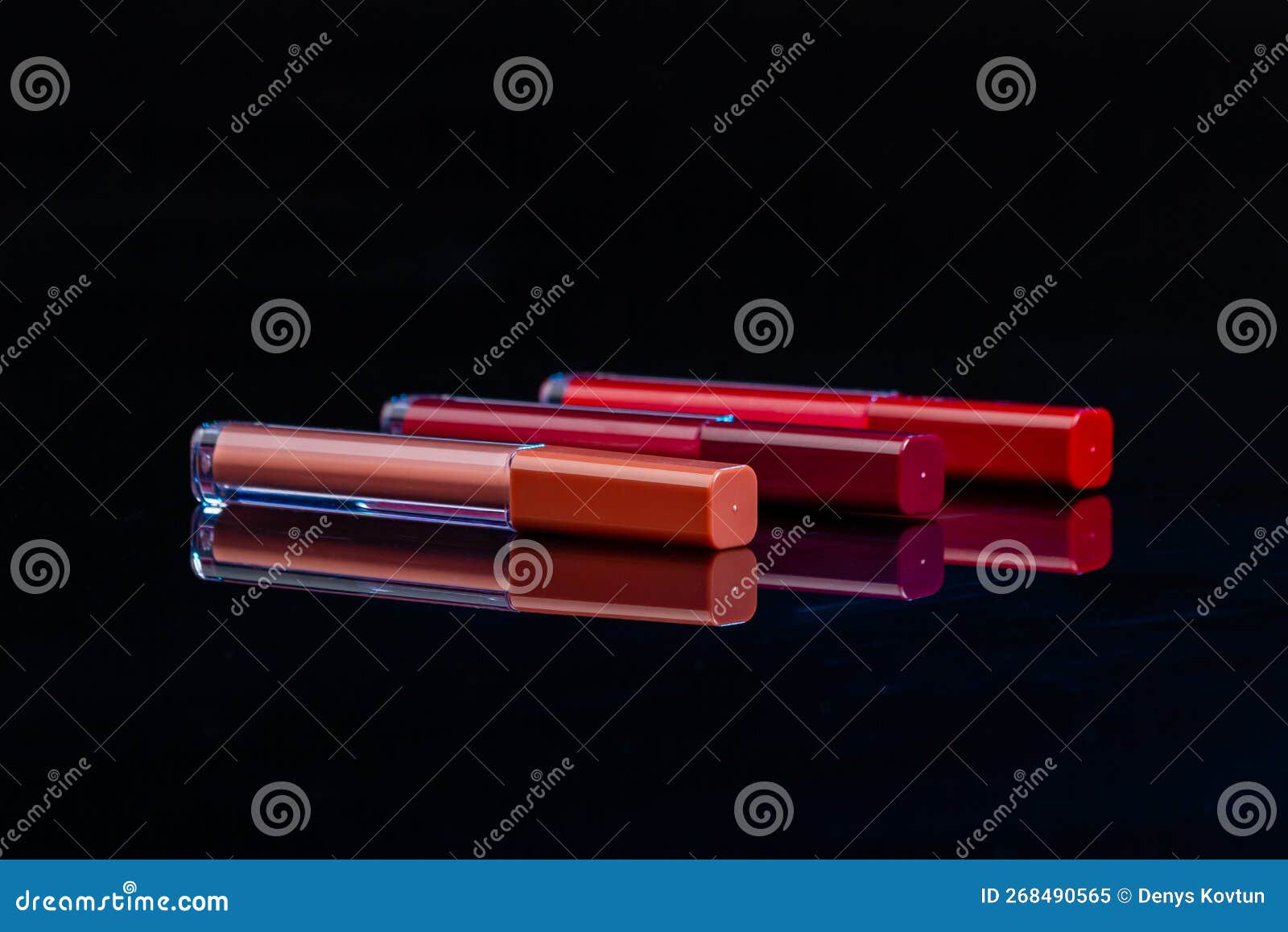 Three Lip Gloss Sticks with Closed Caps. Stock Image - Image of ...