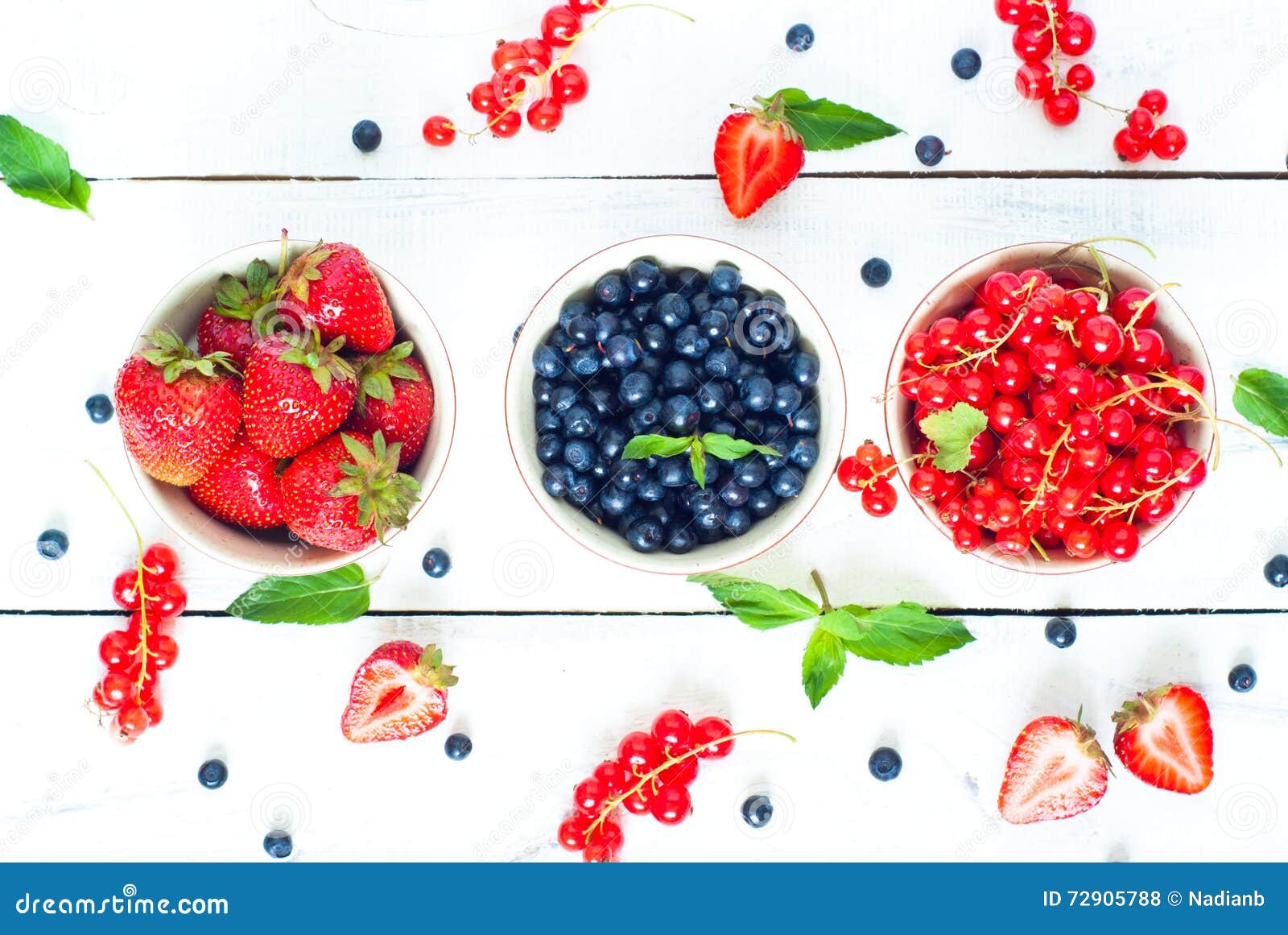 Three Little Bowls with Different Berries Stock Photo - Image of wooden ...