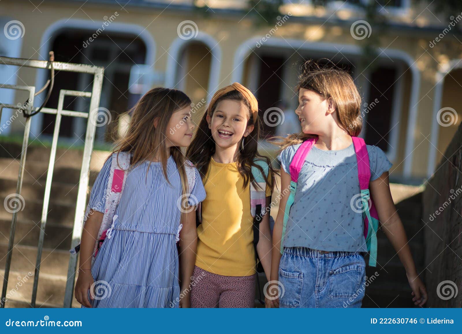 Three Little Girls Leaving School Stock Photo - Image of friendship ...