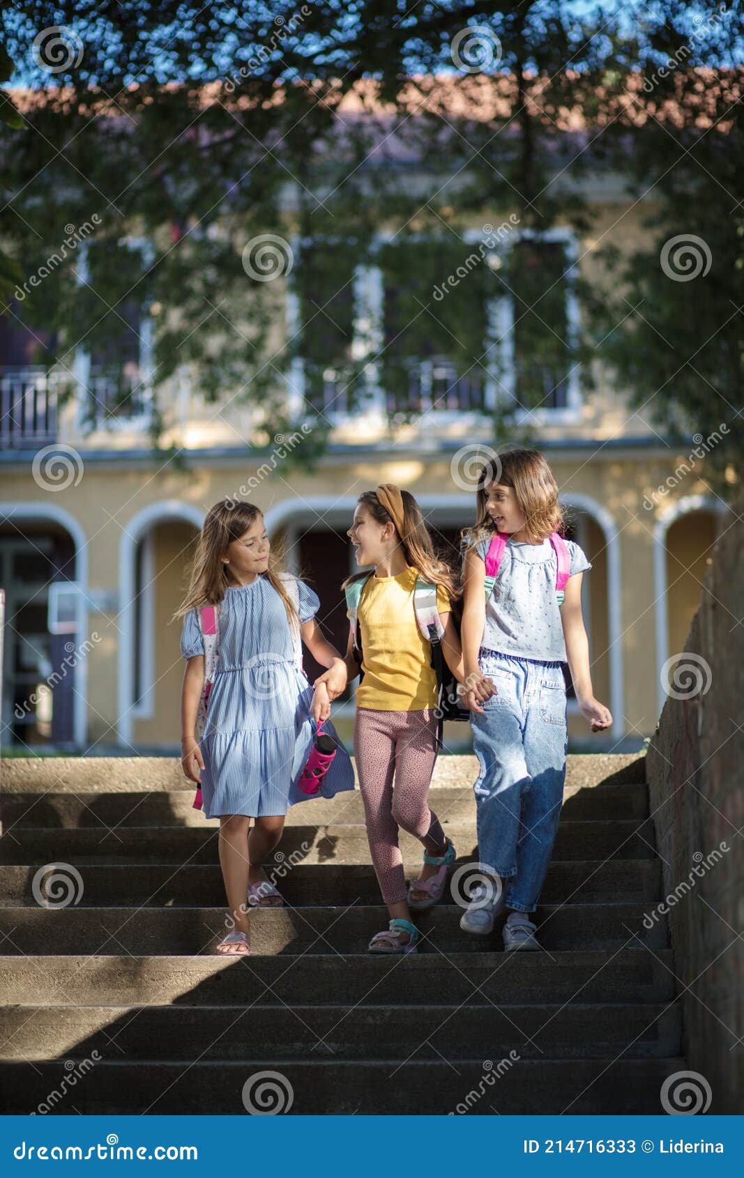 Three Little Girls Leaving School. Stock Image - Image of city ...