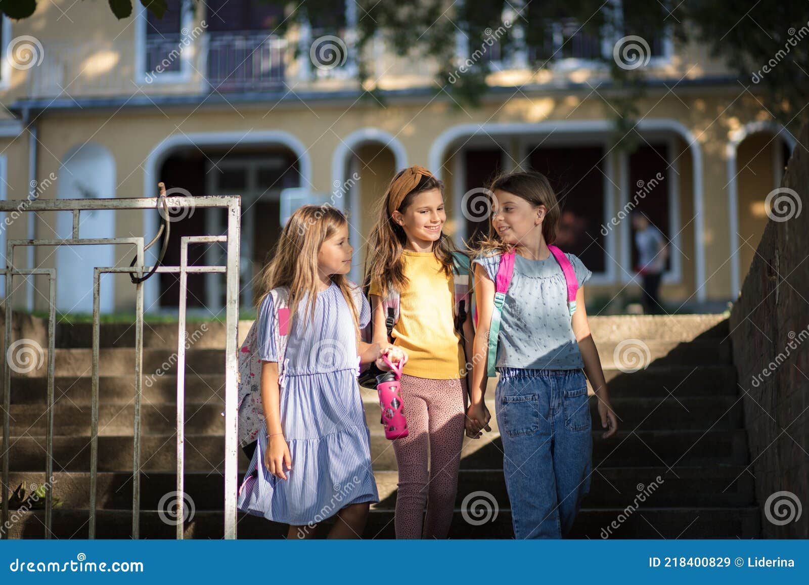 Little Girls Leaving School Together Stock Image - Image of people ...