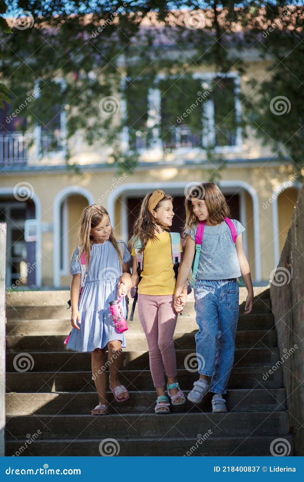 Little Girls Leaving School Together Stock Image - Image of elementary ...