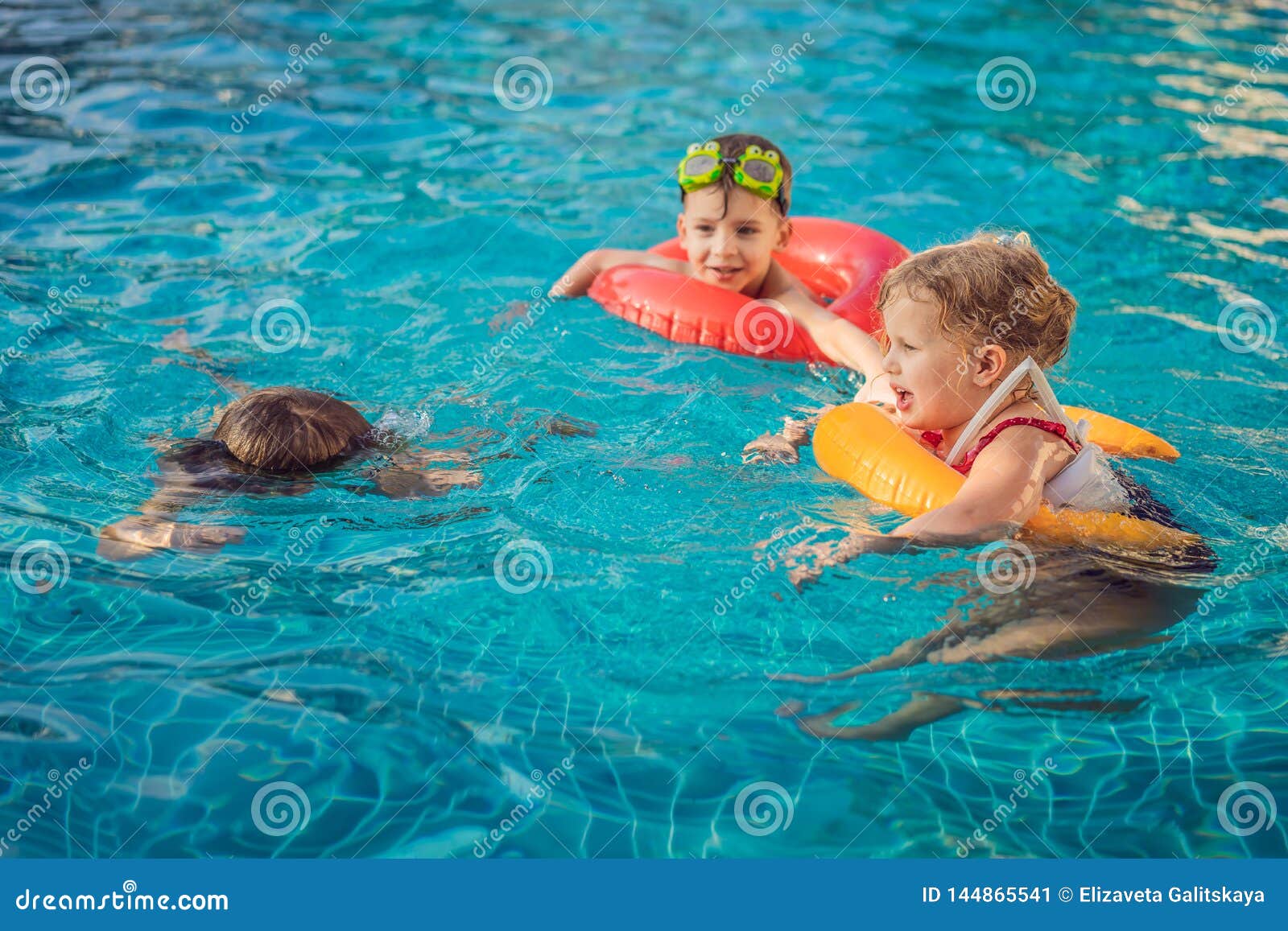 Three Little Kids Playing in the Swimming Pool Stock Image - Image of ...
