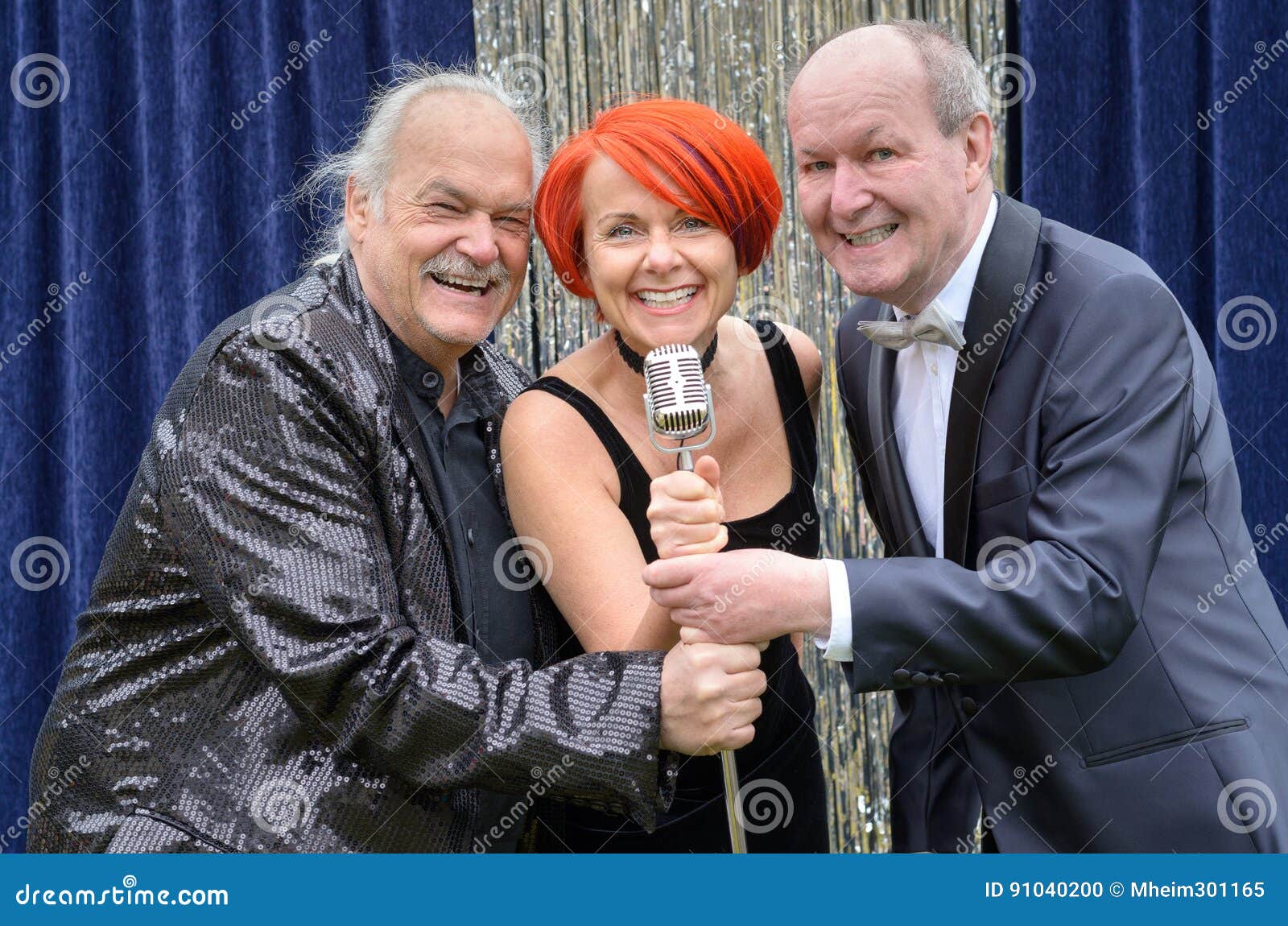 Three Lively Performers Having Fun on Stage Stock Photo - Image of ...