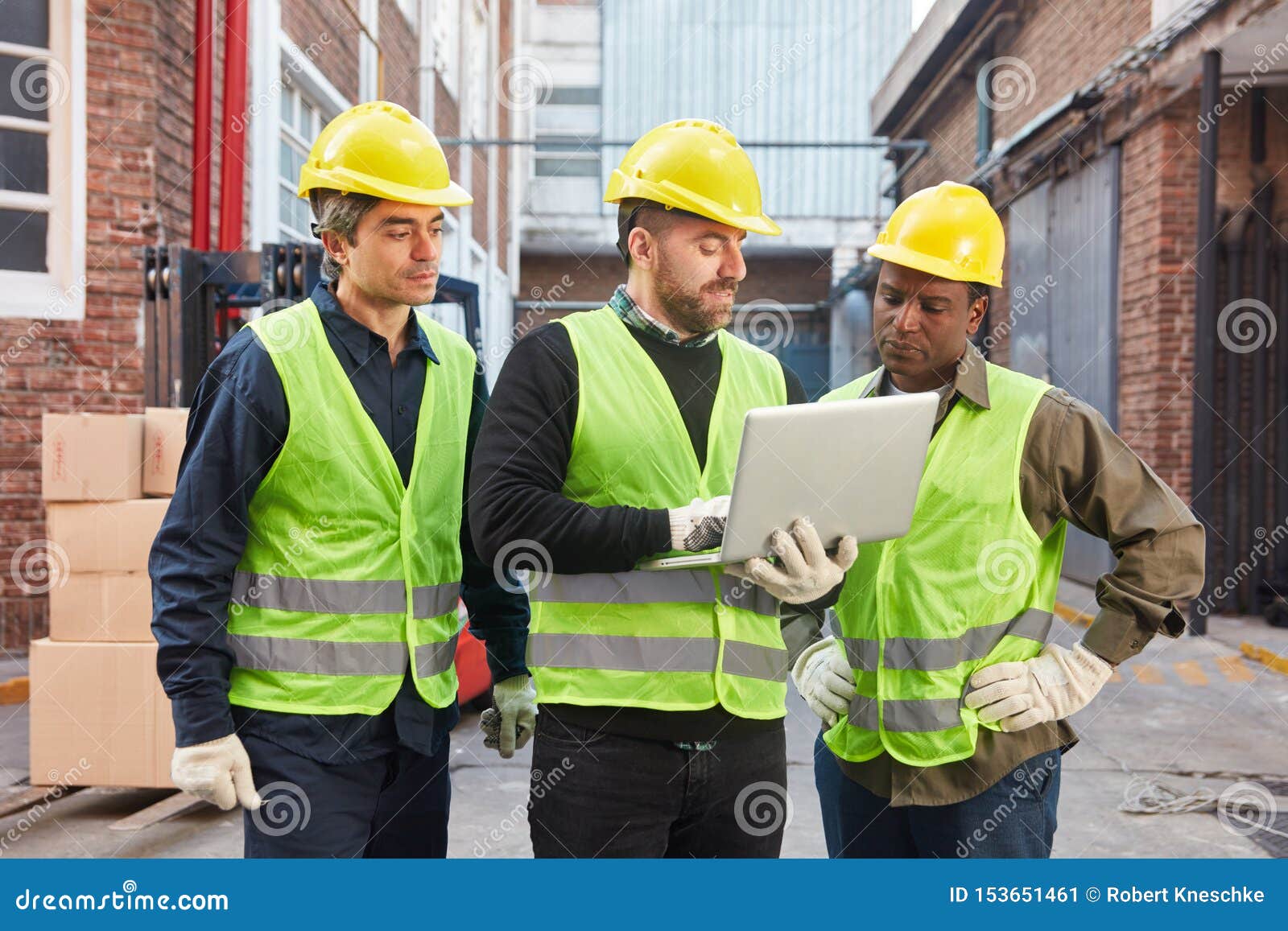 Three Logistics Workers with Laptop Computer Stock Image - Image of ...