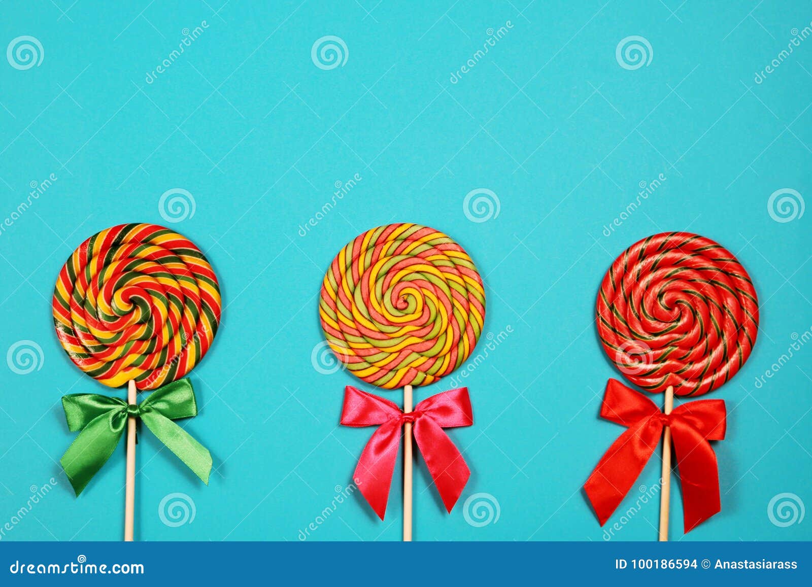 Three Lollipops on Blue Background Stock Photo - Image of childhood ...