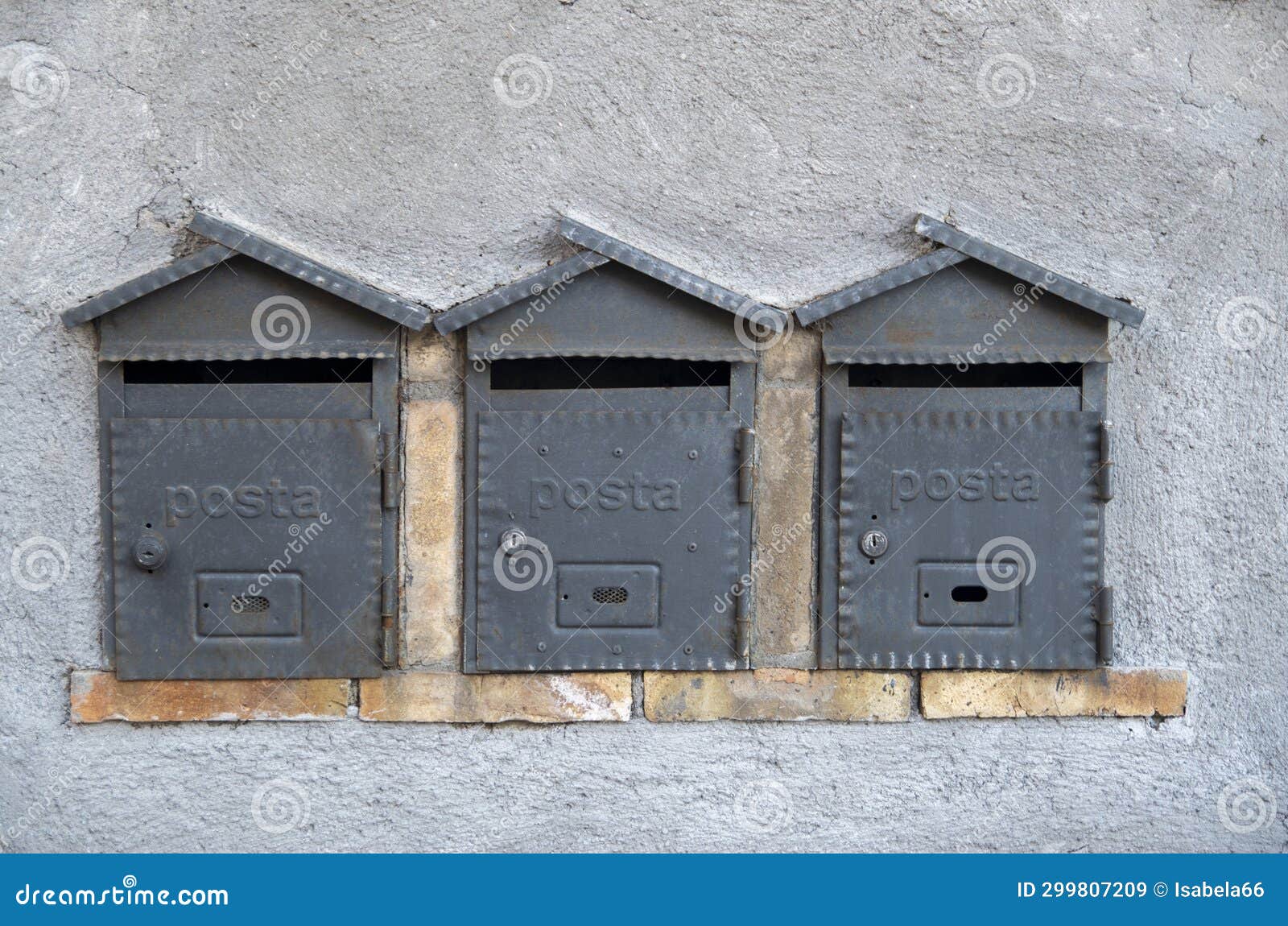 Three Mailboxes in the Shape of Houses Built into a Wall Closeup Stock ...