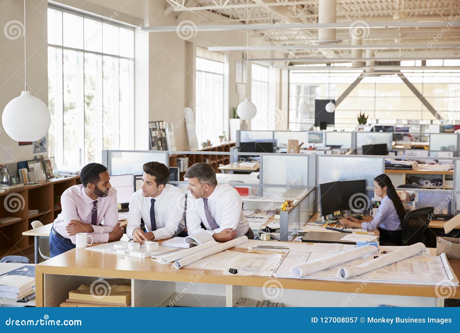 Three Male Architects in Discussion in an Open Plan Office Stock Image ...