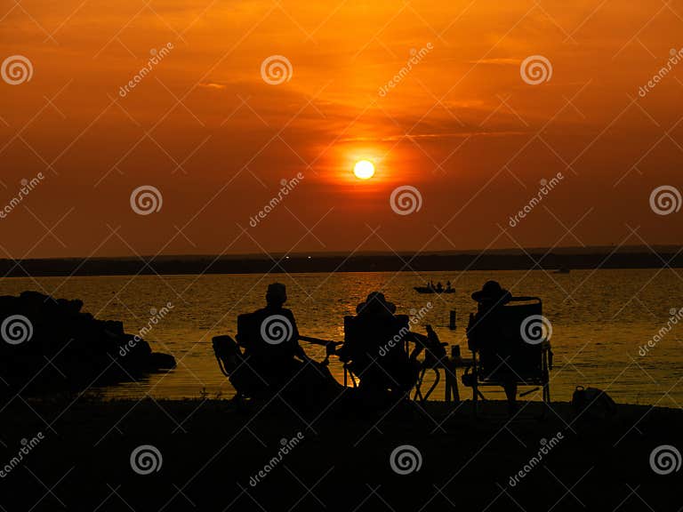 Three man under sunset stock image. Image of afterglow - 286475715
