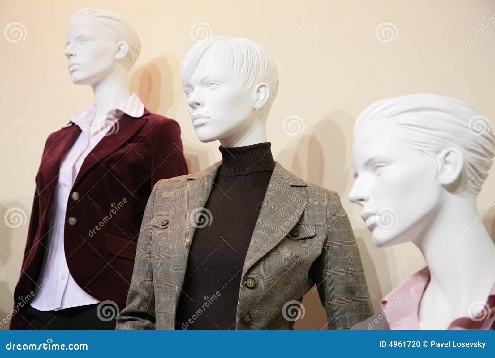 Three Mannequins Of Men Dressed In Casual Clothes Are Standing In The ...