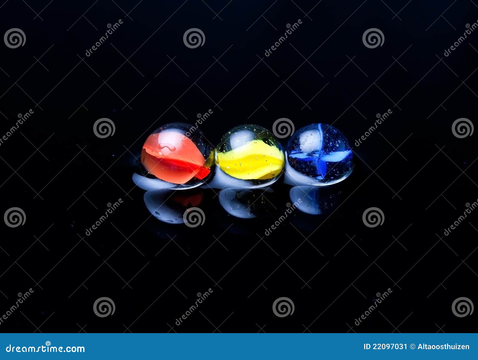 Three Marbles Lying in Water Stock Image - Image of liquid, breakable ...