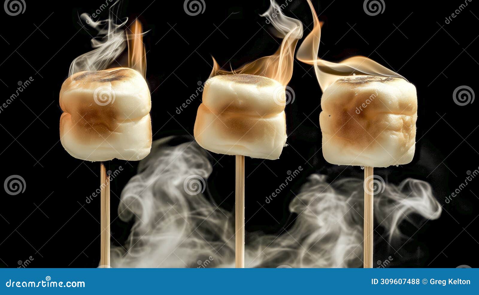 Three Marshmallows on Sticks with Flames and Smoke Rising As they are ...