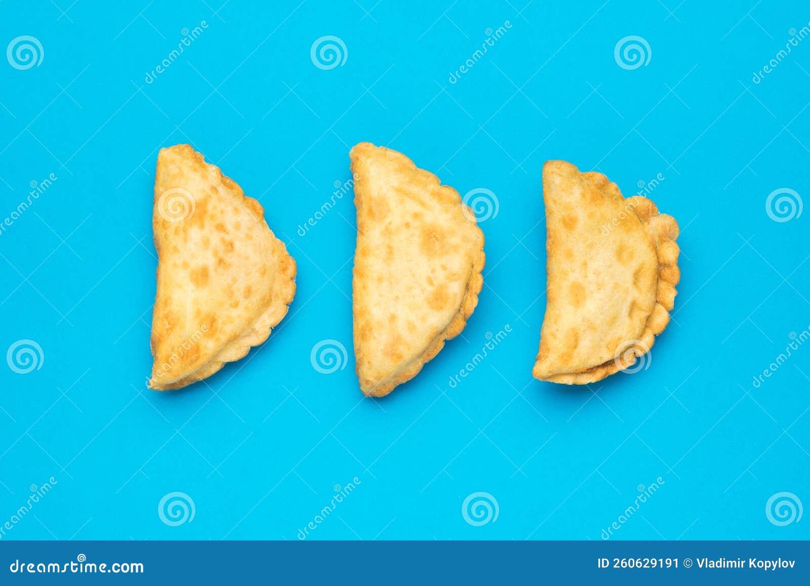 Three Meat Pies on a Light Blue Background Stock Image - Image of ...