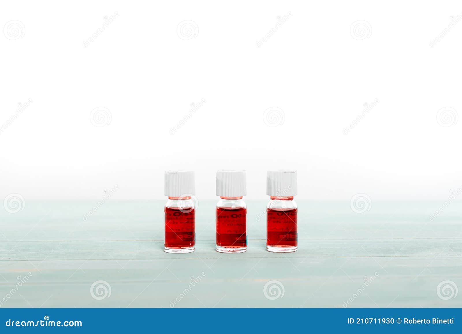Three Medicine Vials Filled with Red Liquid Stock Photo - Image of ...