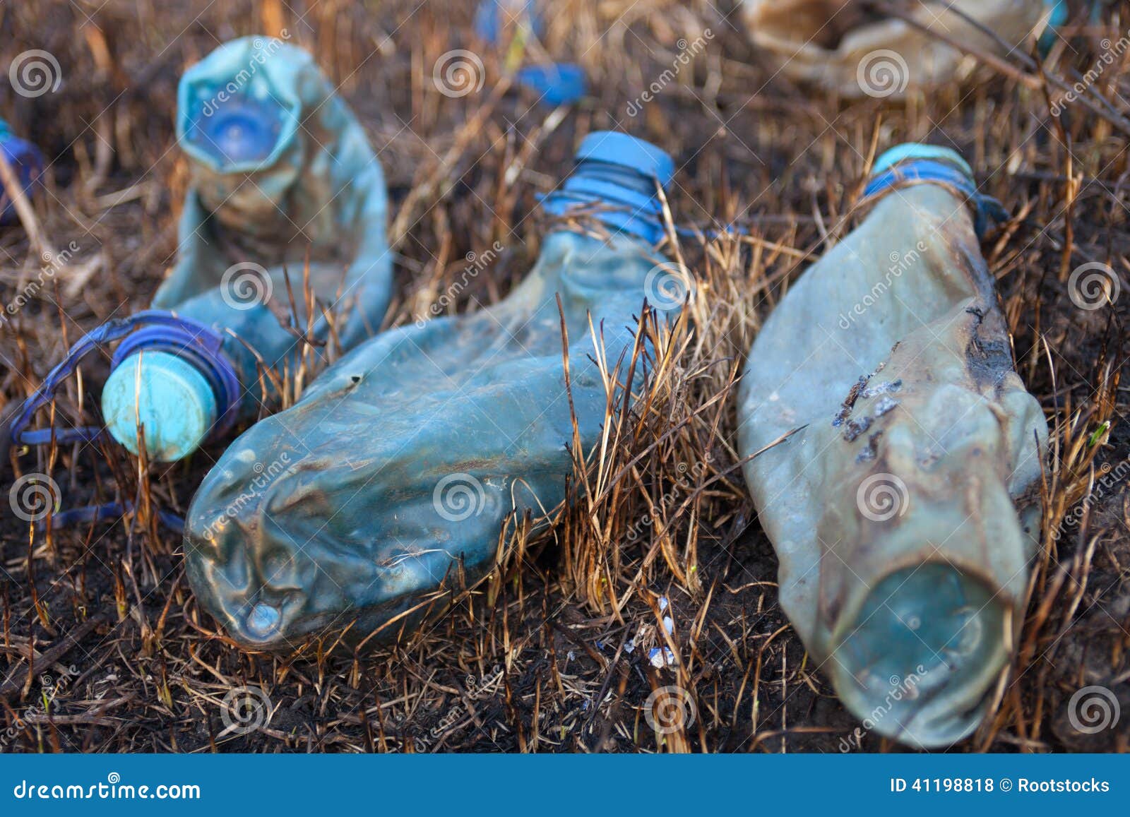 Three Melted Plastic Bottles on the Burnt Grass Stock Photo - Image of ... Three Melted Plastic Bottles on the Burnt Grass Stock Photo - Image of ...