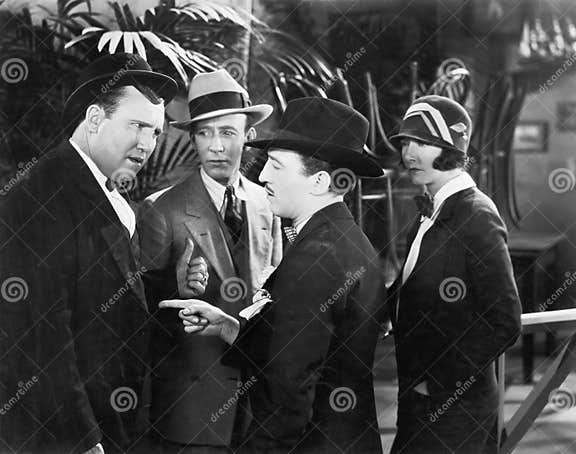 Three Men in an Argument while a Woman Looking on Stock Photo - Image ...