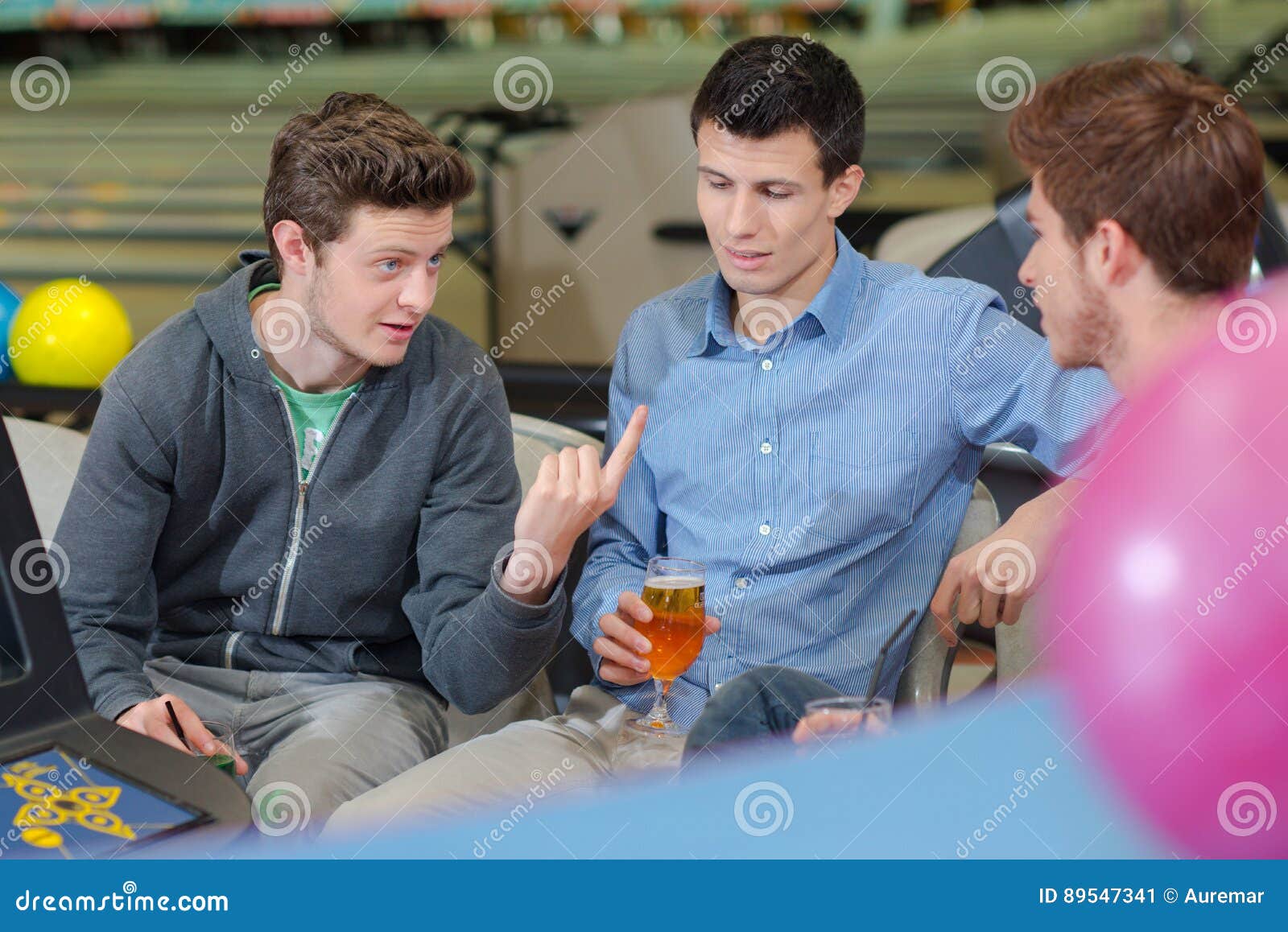Three Men Having Conversation in Bowling Center Stock Image - Image of ...