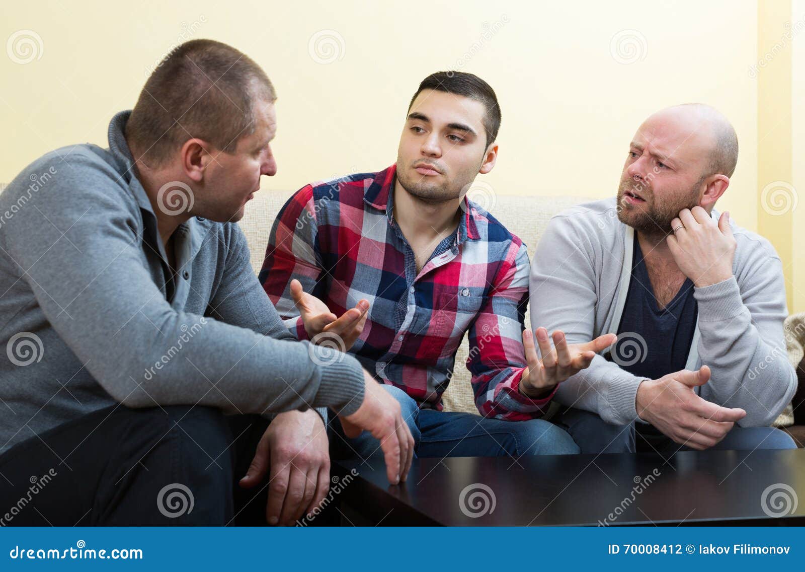 Three men at home stock photo. Image of rest, ordinary - 70008412