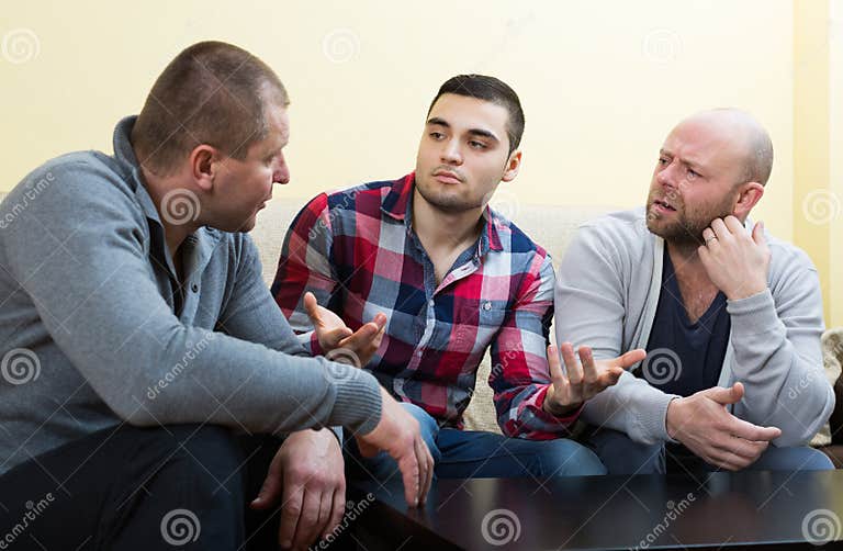 Three men at home stock photo. Image of rest, ordinary - 70008412