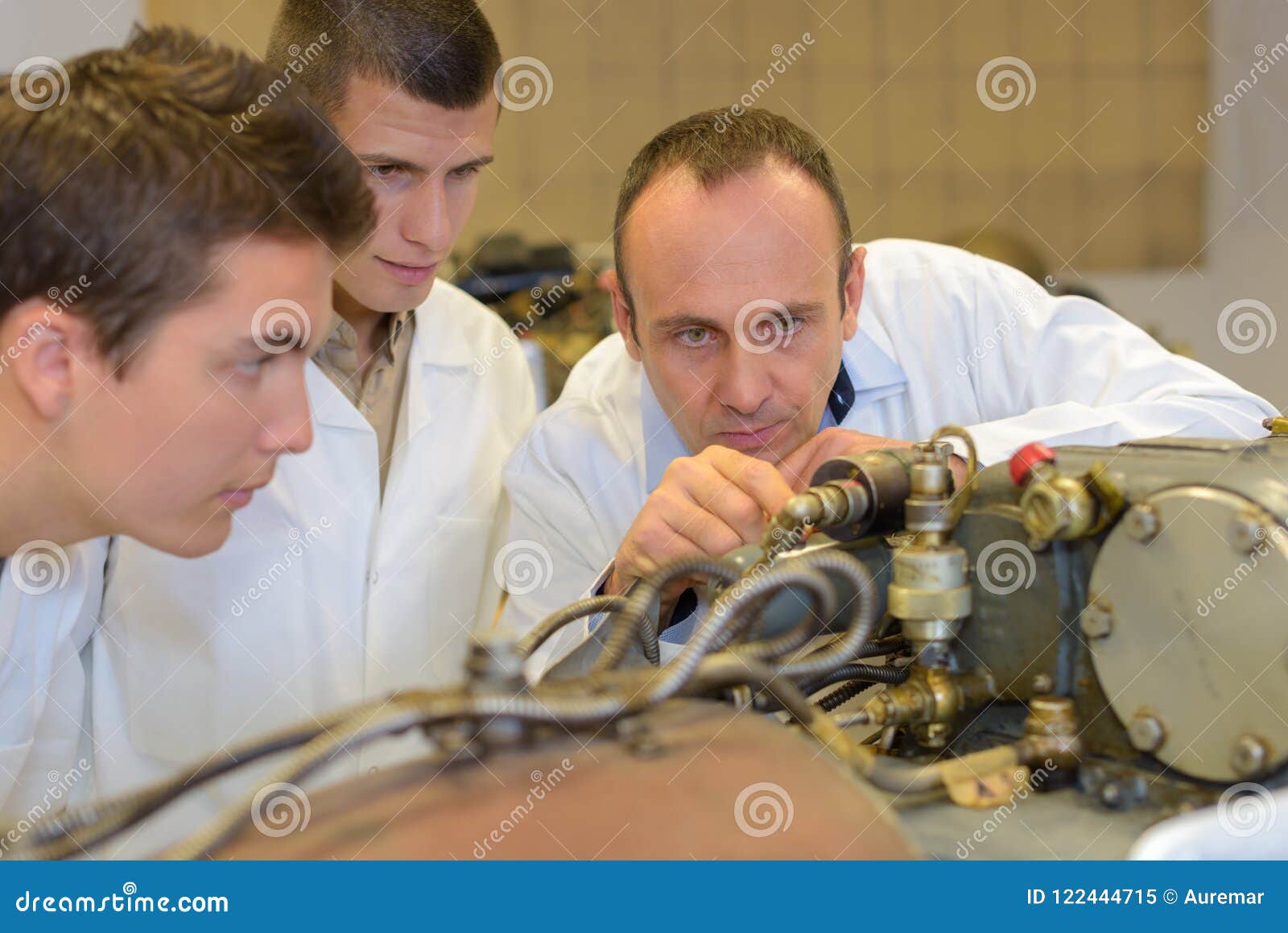 Three Men Looking at Engineering Invention Stock Image - Image of ...