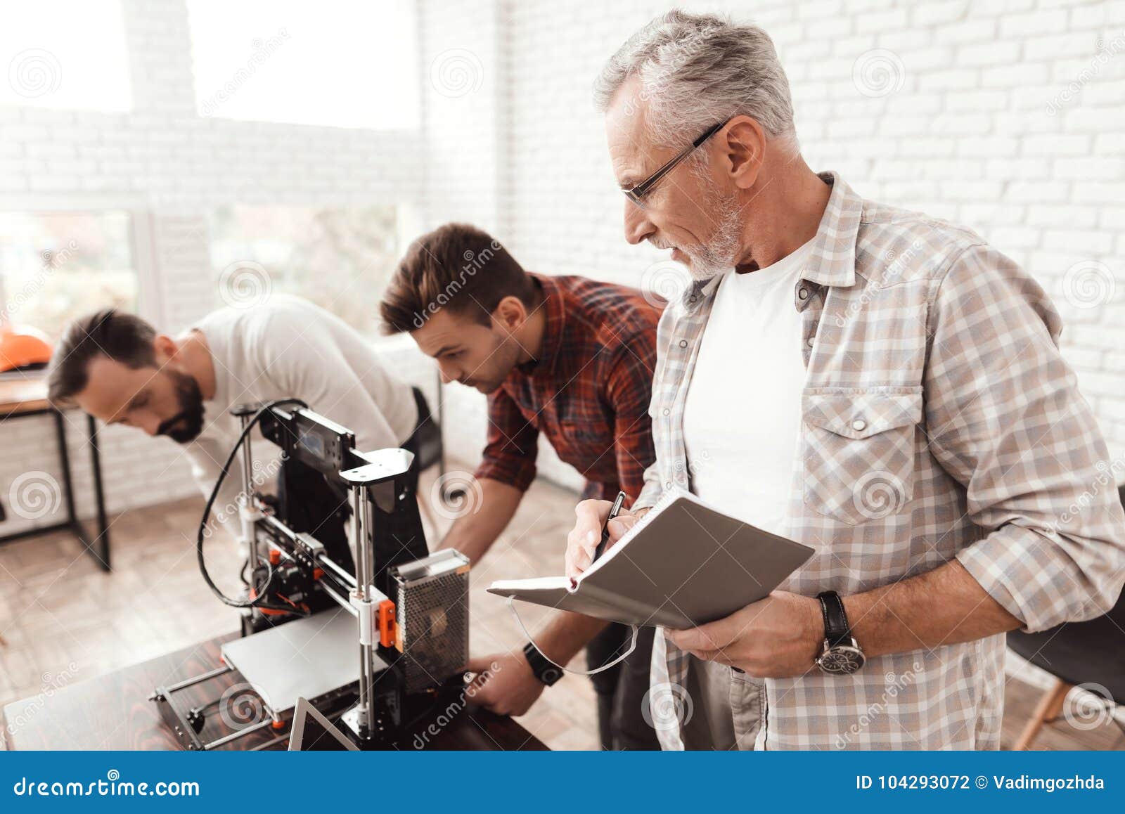 Three Men Set Up a Self-made 3d Printer To Print the Workpiece. an ...