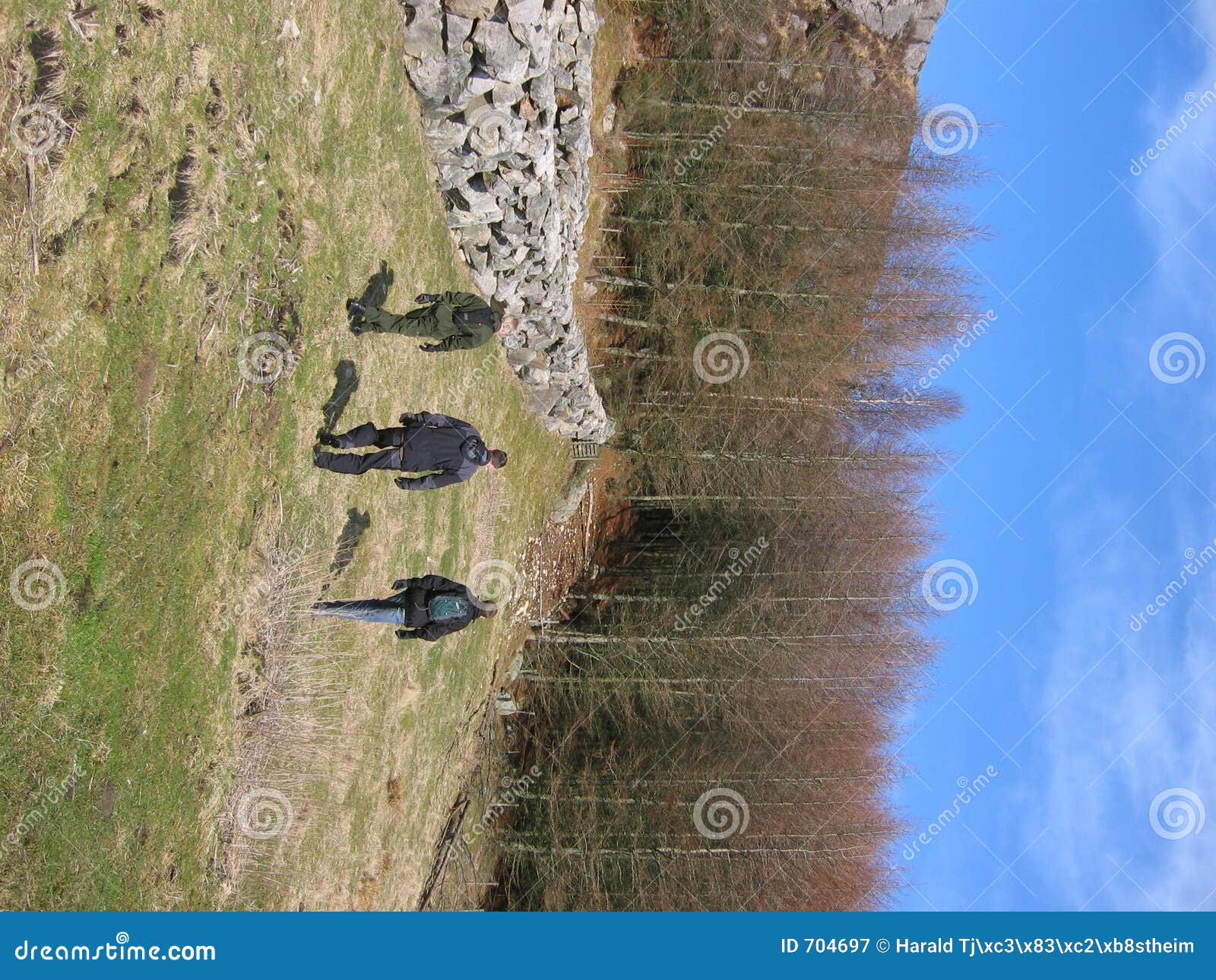 Three men tracking stock image. Image of fence, cloud, group - 704697