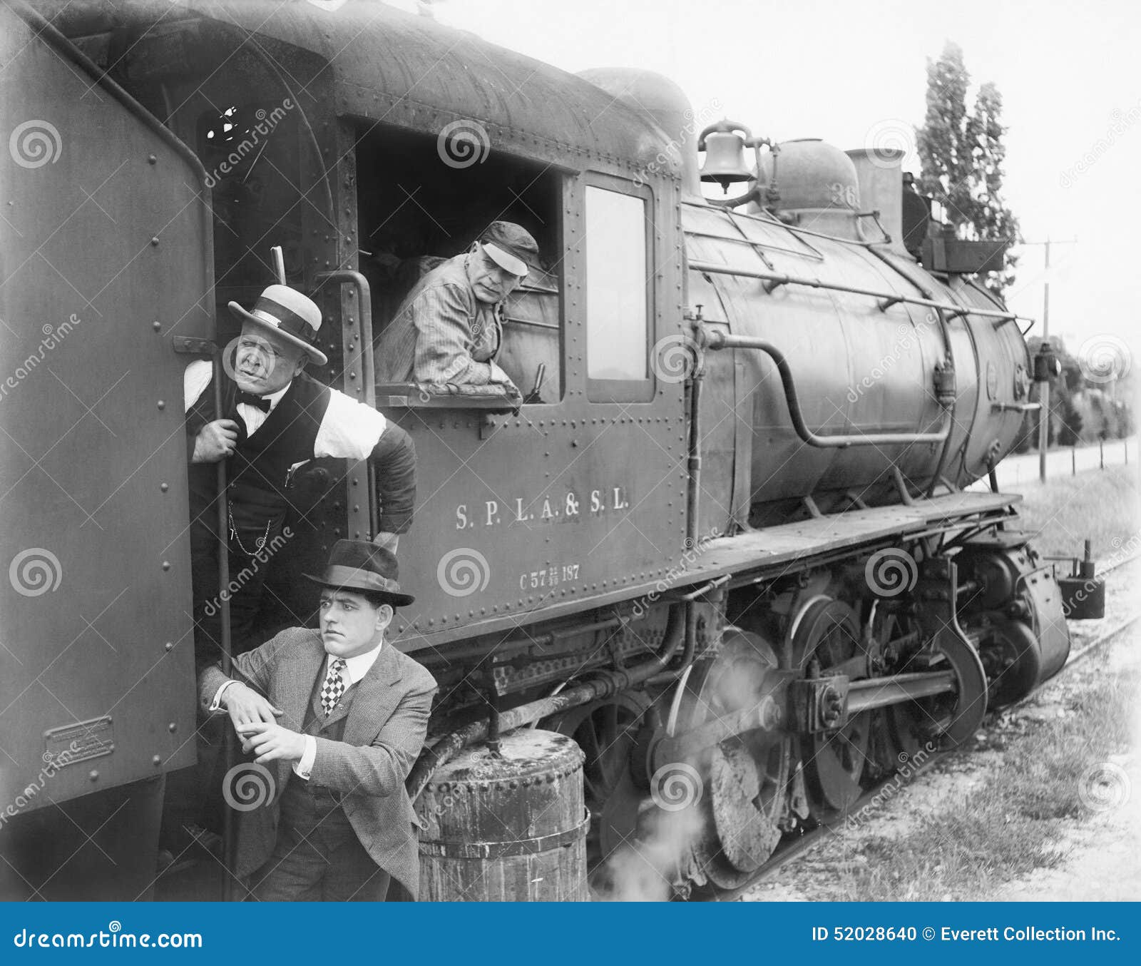 Three Men Waiting at a Steam Locomotive Stock Photo - Image of gazing ...