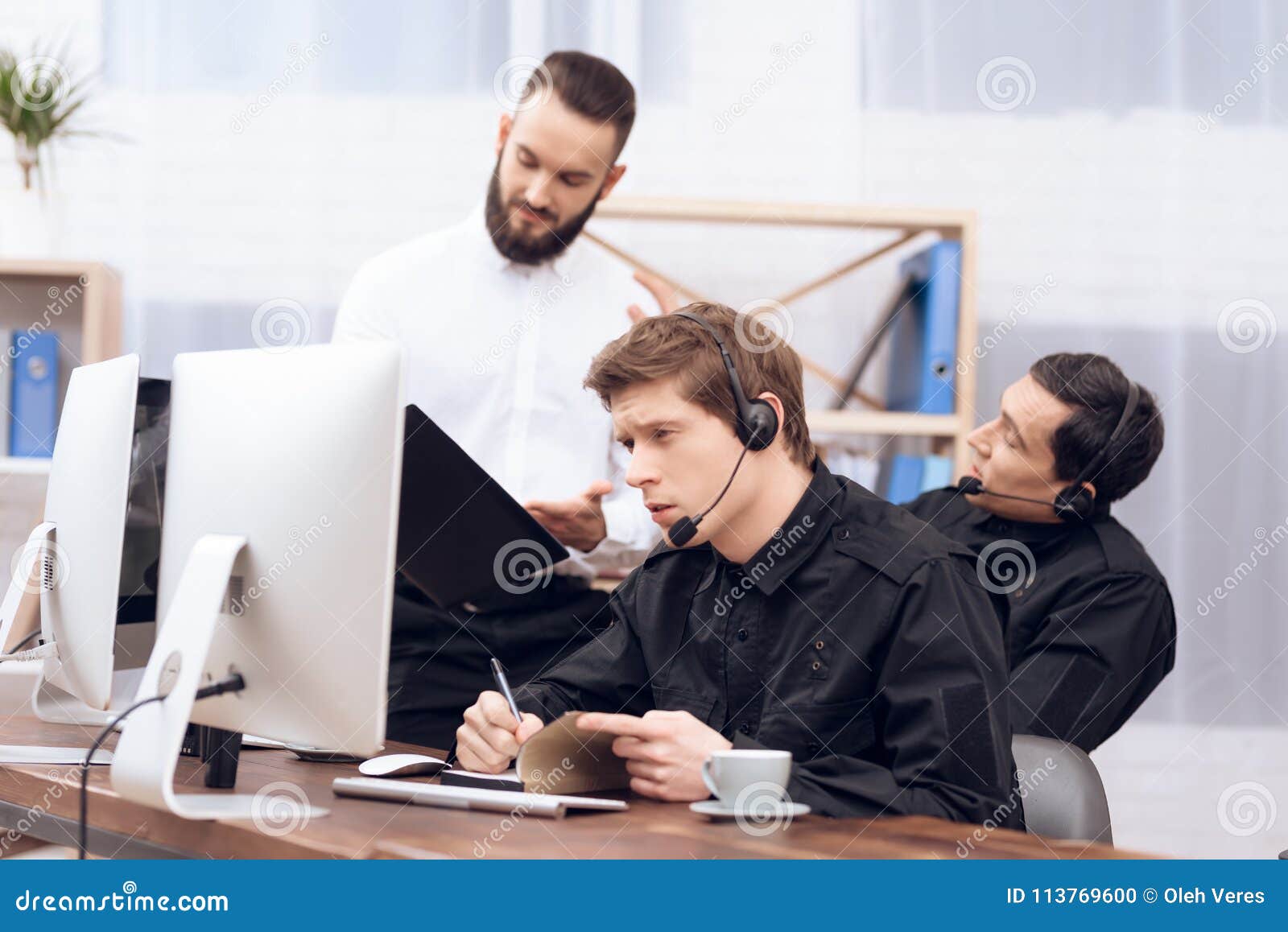 Three Men Work in the Security Room. Stock Photo - Image of radio ...