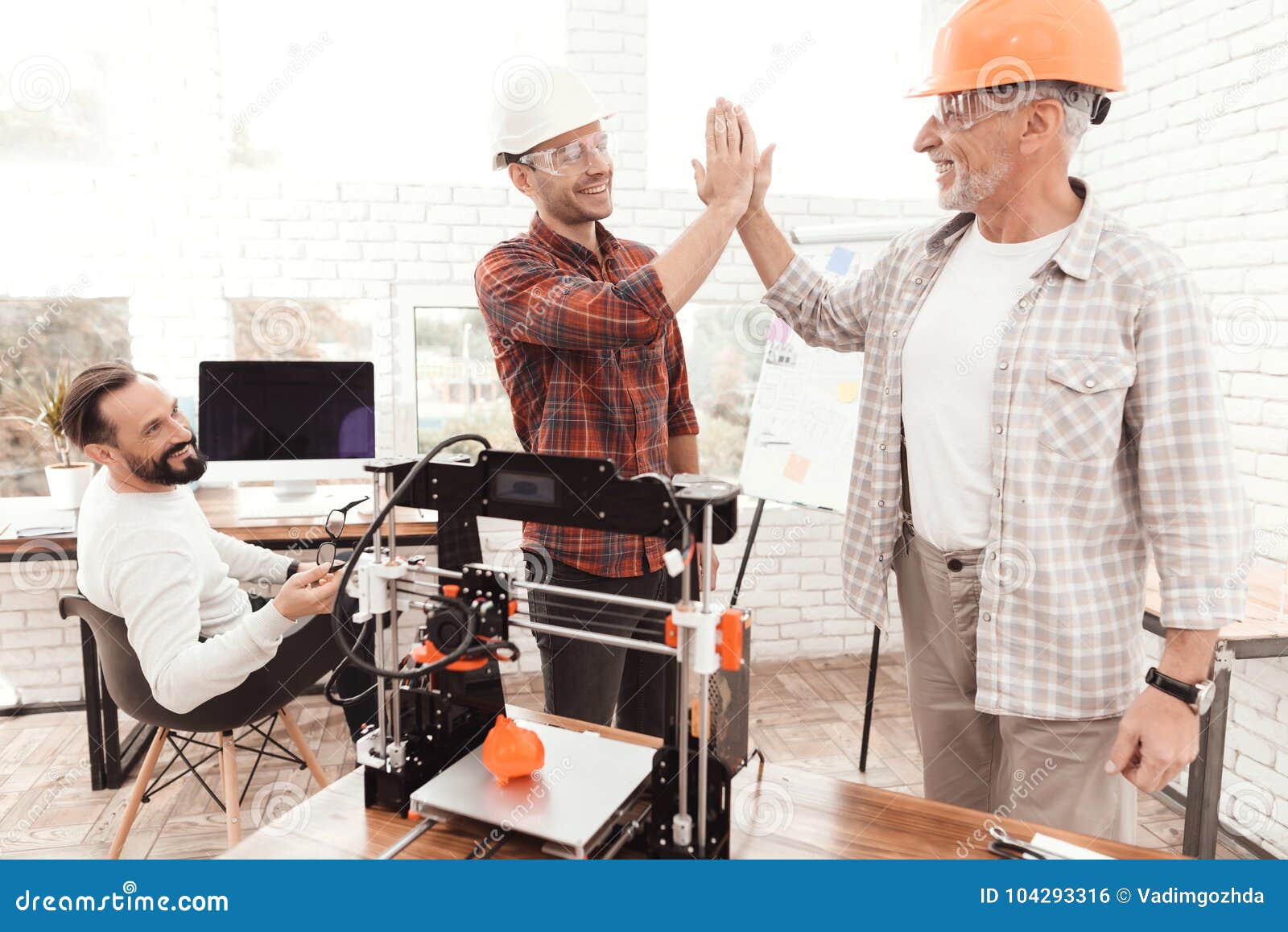 Three Men are Working To Prepare Printed on a 3d Model Printer. they ...