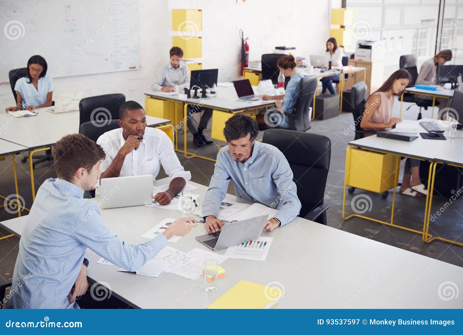Three Men Working Together in a Busy Office, Elevated View Stock Image ...