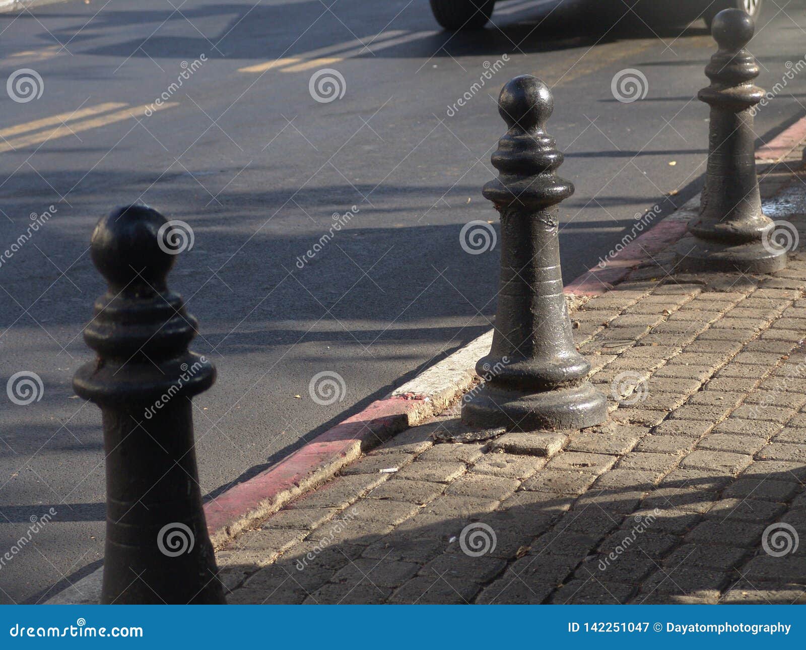 Three Metal Posts on a Paved Sidewalk Urban View in Daylight Stock ...