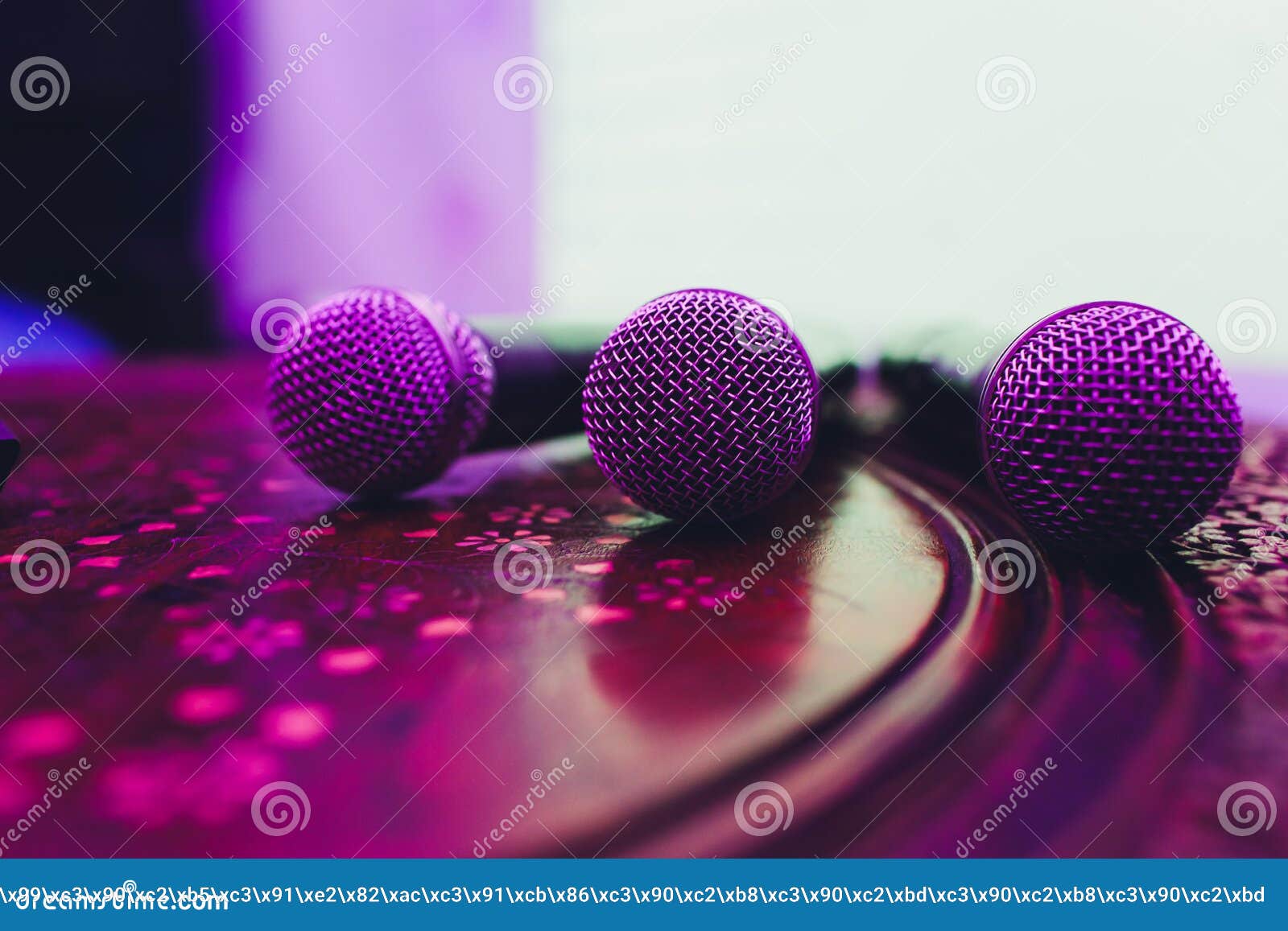 Three Microphones in Group on Red Table with Copy Space. Stock Image ...