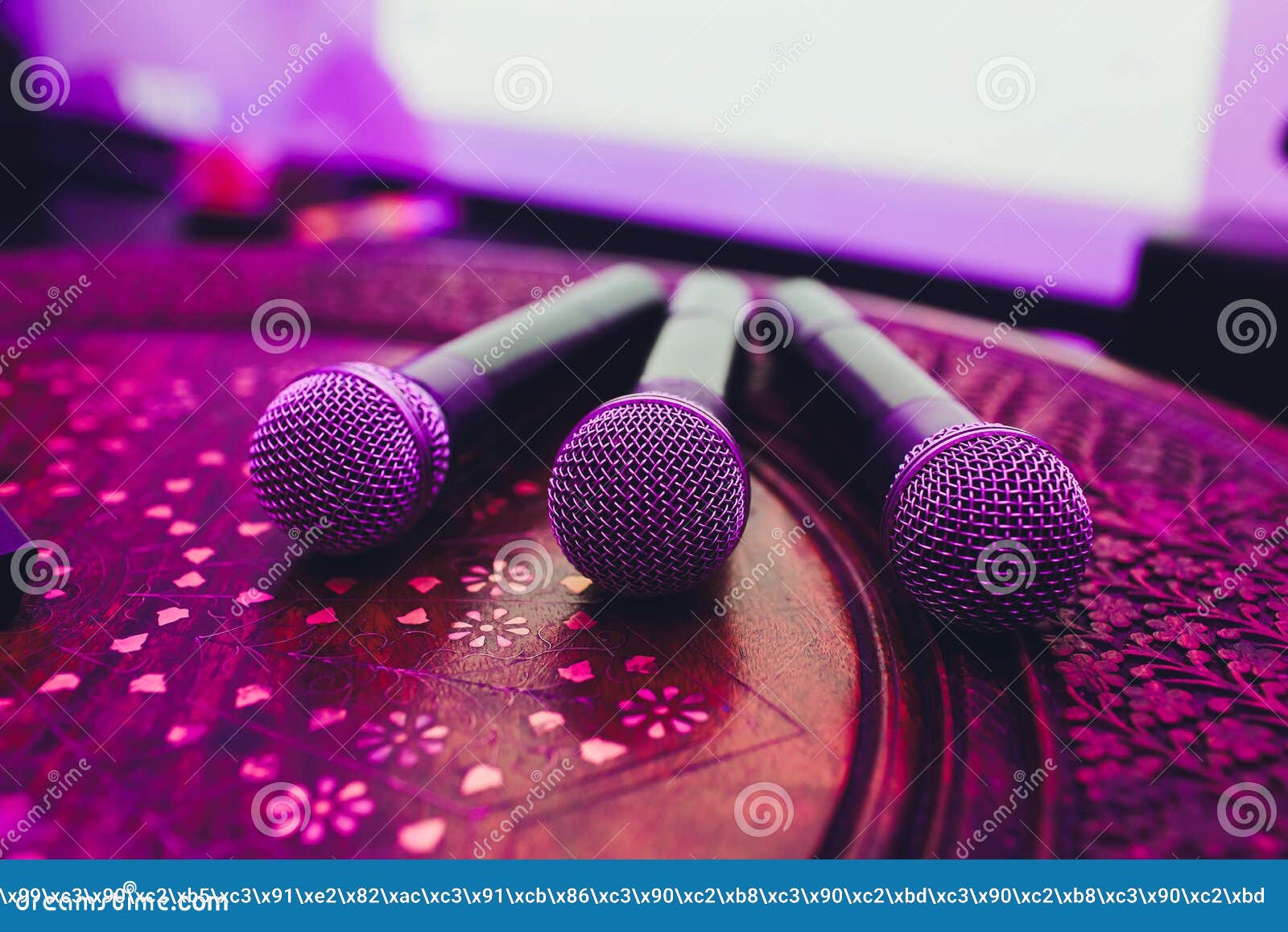 Three Microphones in Group on Red Table with Copy Space. Stock Photo ...