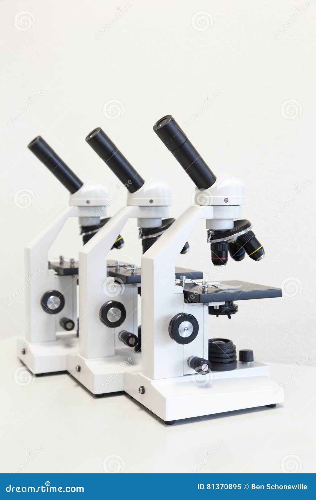 Three Microscopes in a Row Isolated on Background Stock Image - Image ...